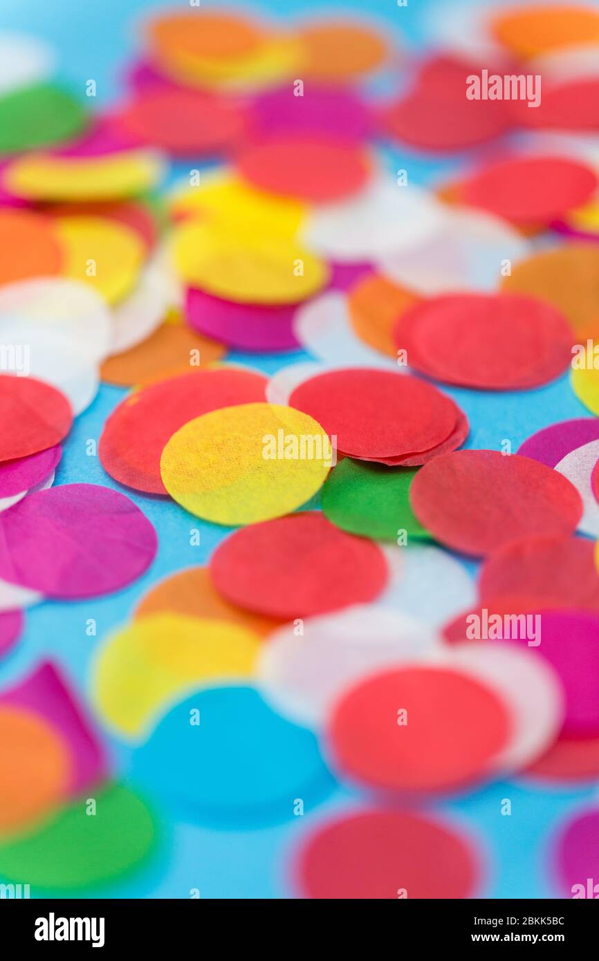 colorful confetti decoration on blue background Stock Photo - Alamy