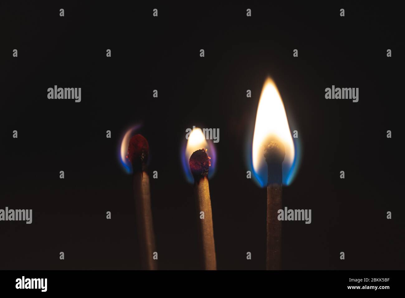 Three match sticks burning isolated on a black background Stock Photo ...