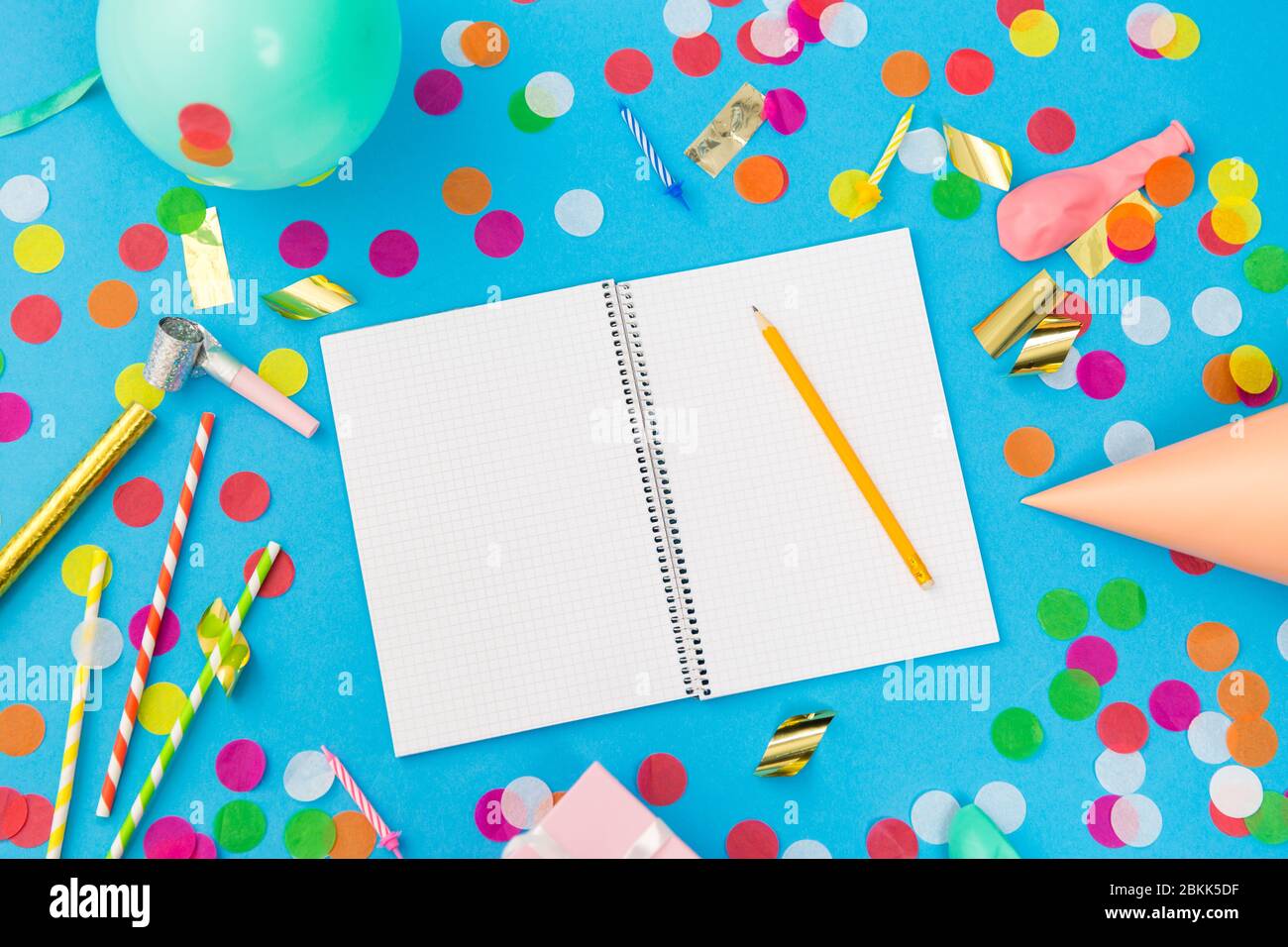 notebook with pencil and birthday party props Stock Photo - Alamy