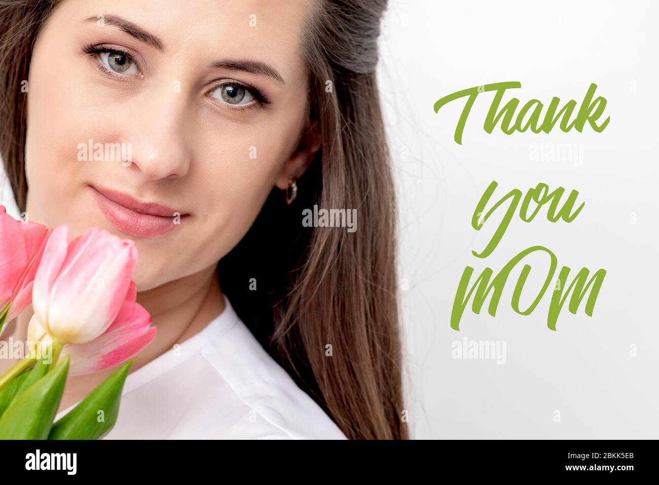 Beautiful young woman with pink tulips on white background with text ...