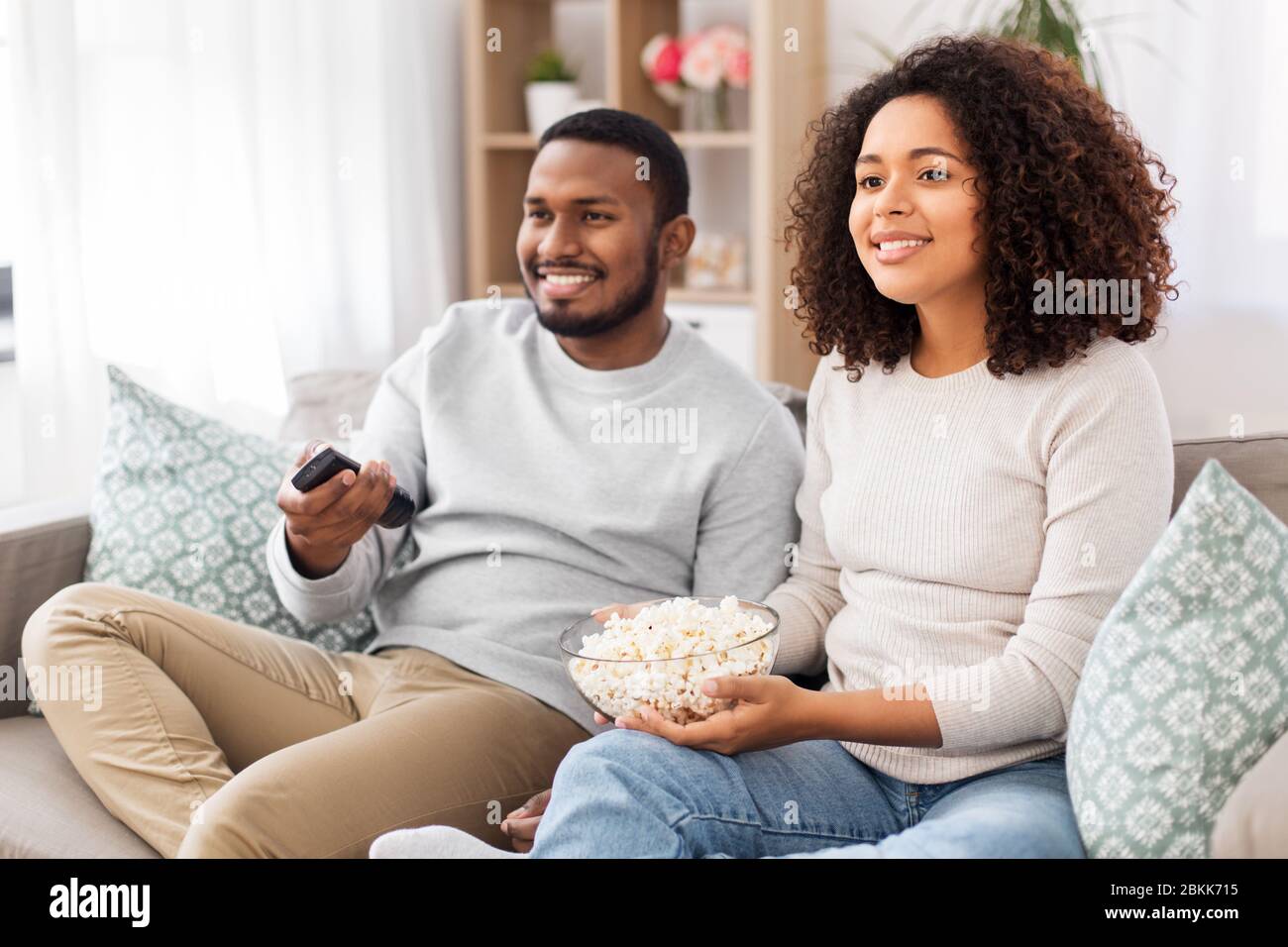 African american family watching tv hi-res stock photography and images - Alamy