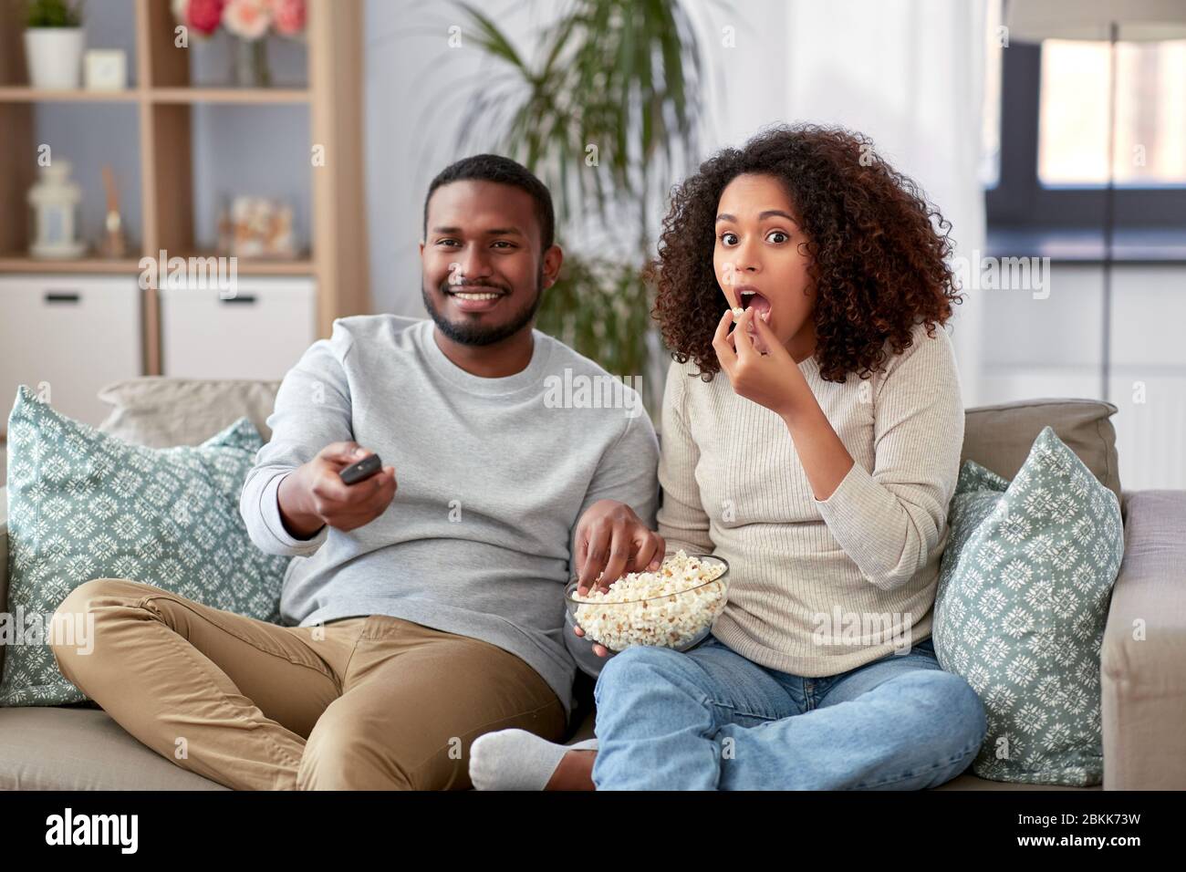 African american family watching tv hi-res stock photography and images - Alamy