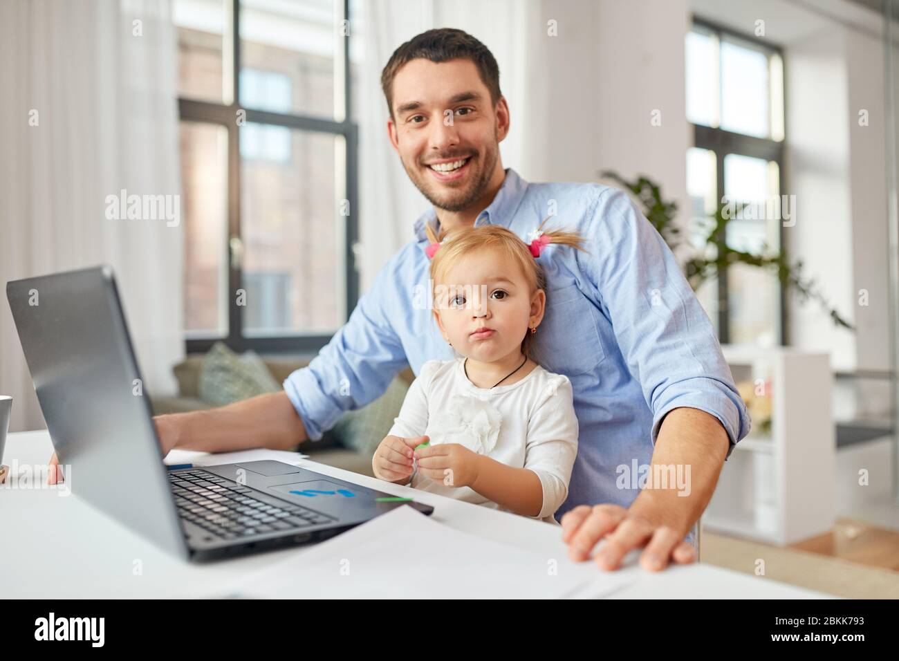 Busy father working laptop hi-res stock photography and images - Alamy