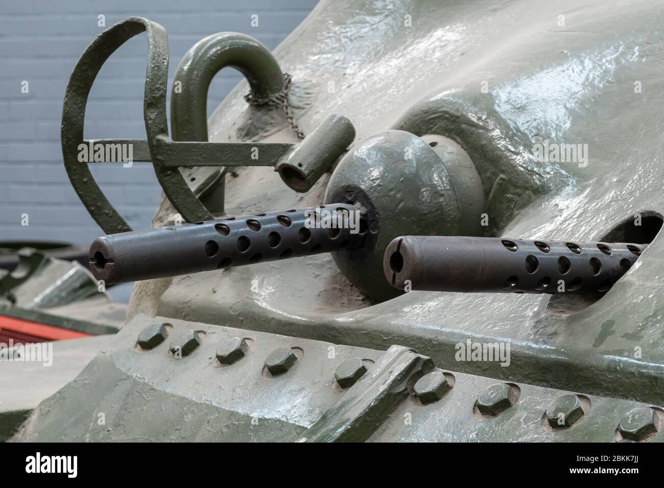 Close up of machine guns on the front of a tank Stock Photo - Alamy