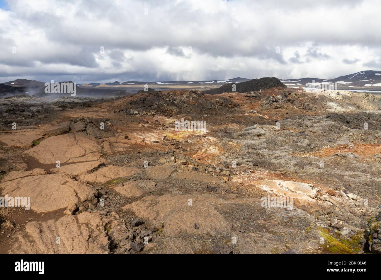 A steaming section of the Krafla lava field in the Krafla volcanic area ...