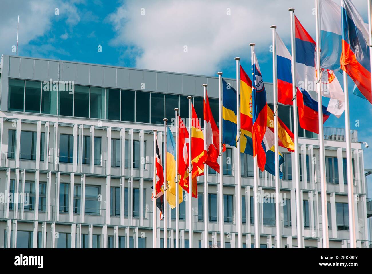 flags of European countries developing on flagpoles near the building ...
