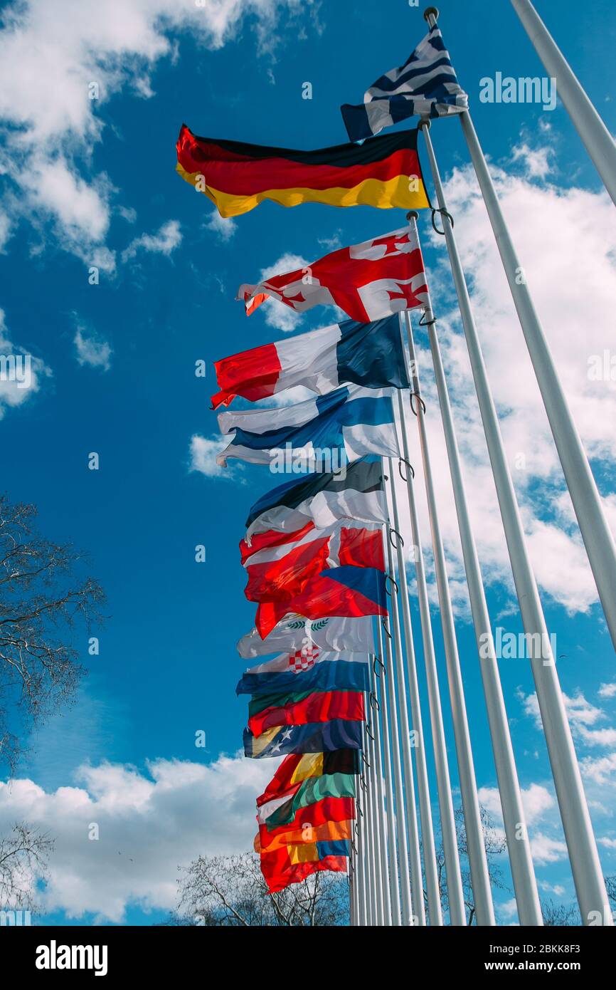 flags of European countries developing on flagpoles near the building ...