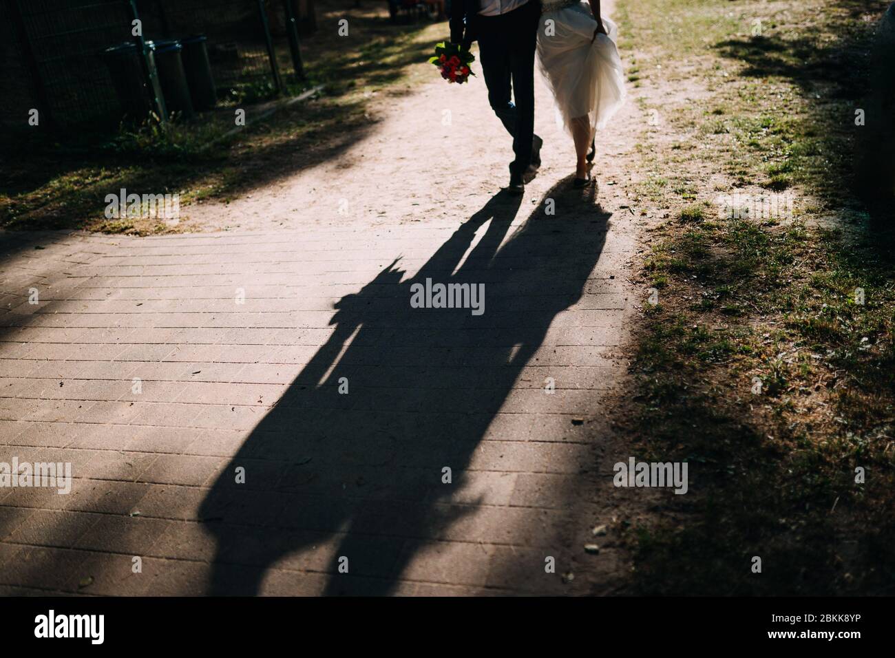 a married couples feet walking Stock Photo - Alamy