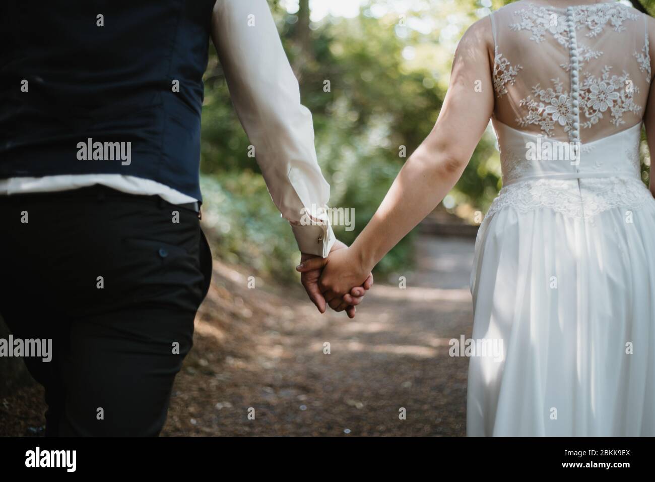 two married couple holding hands Stock Photo - Alamy