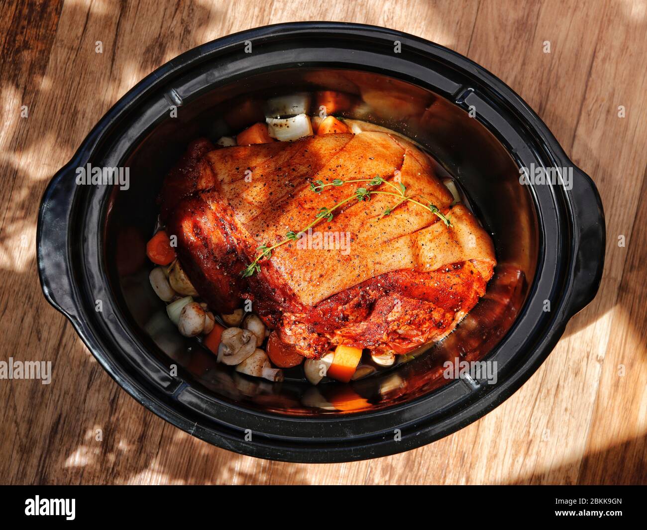 Pork shoulder prepared and ready in a slow cooker in order to make ...