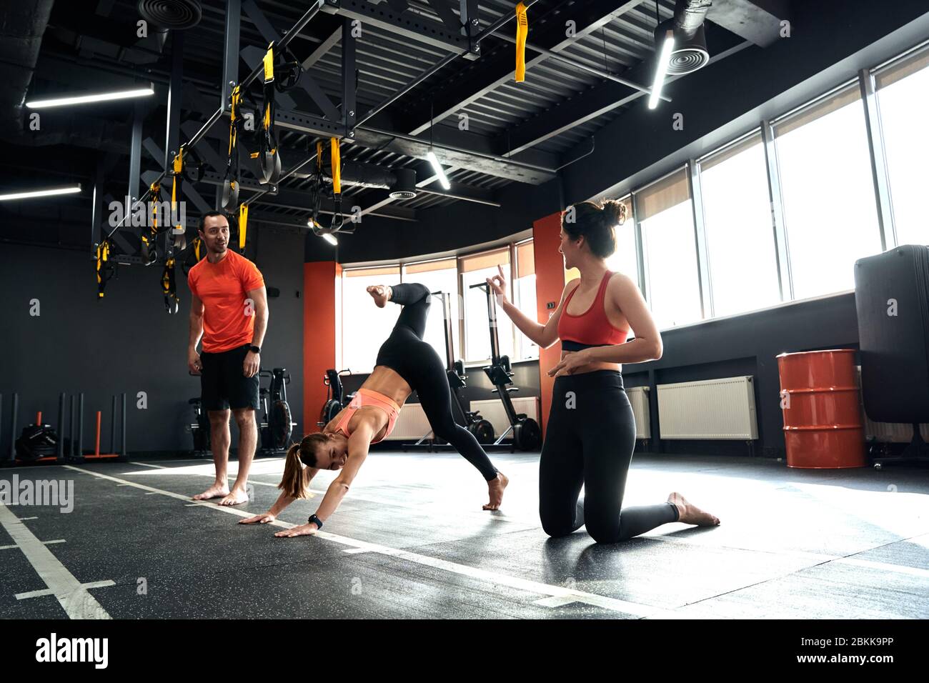 Group of young adult sporty people making fun on training session Stock ...