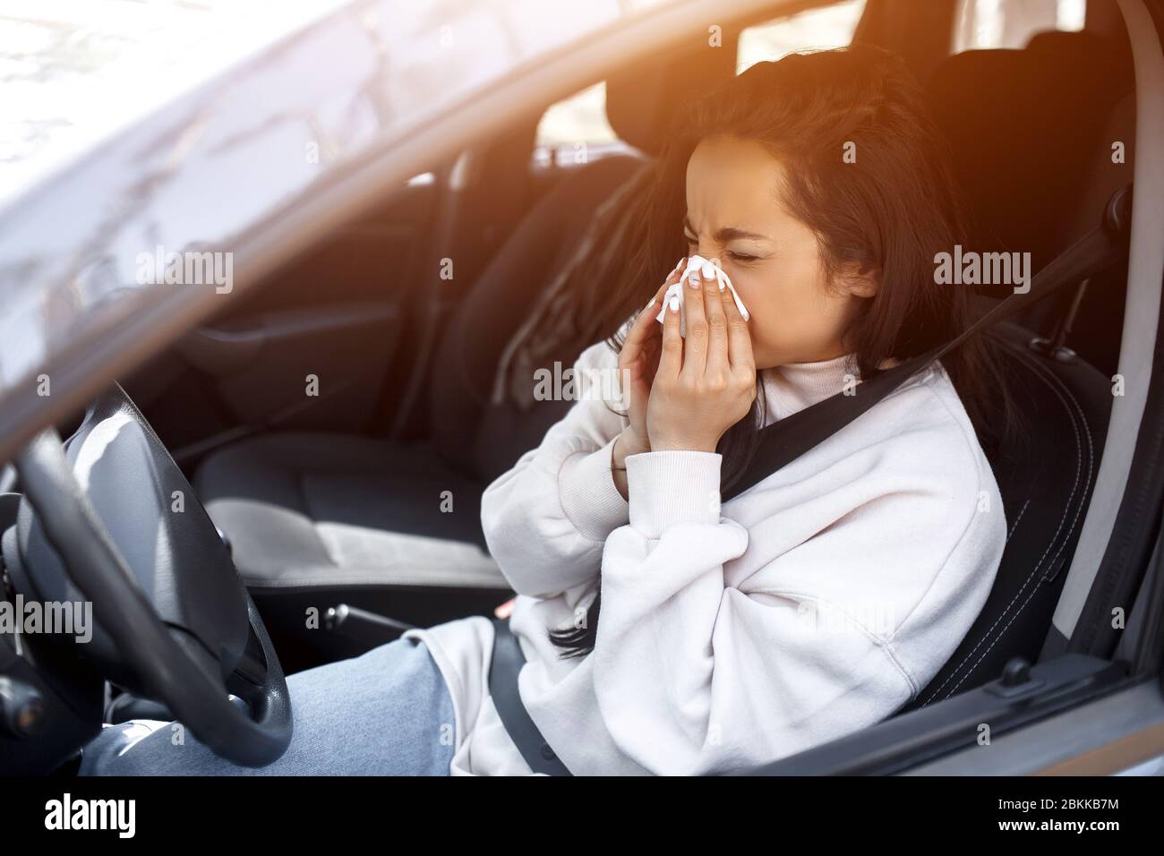 woman with handkerchief. Sick girl has runny nose. Female model makes a ...
