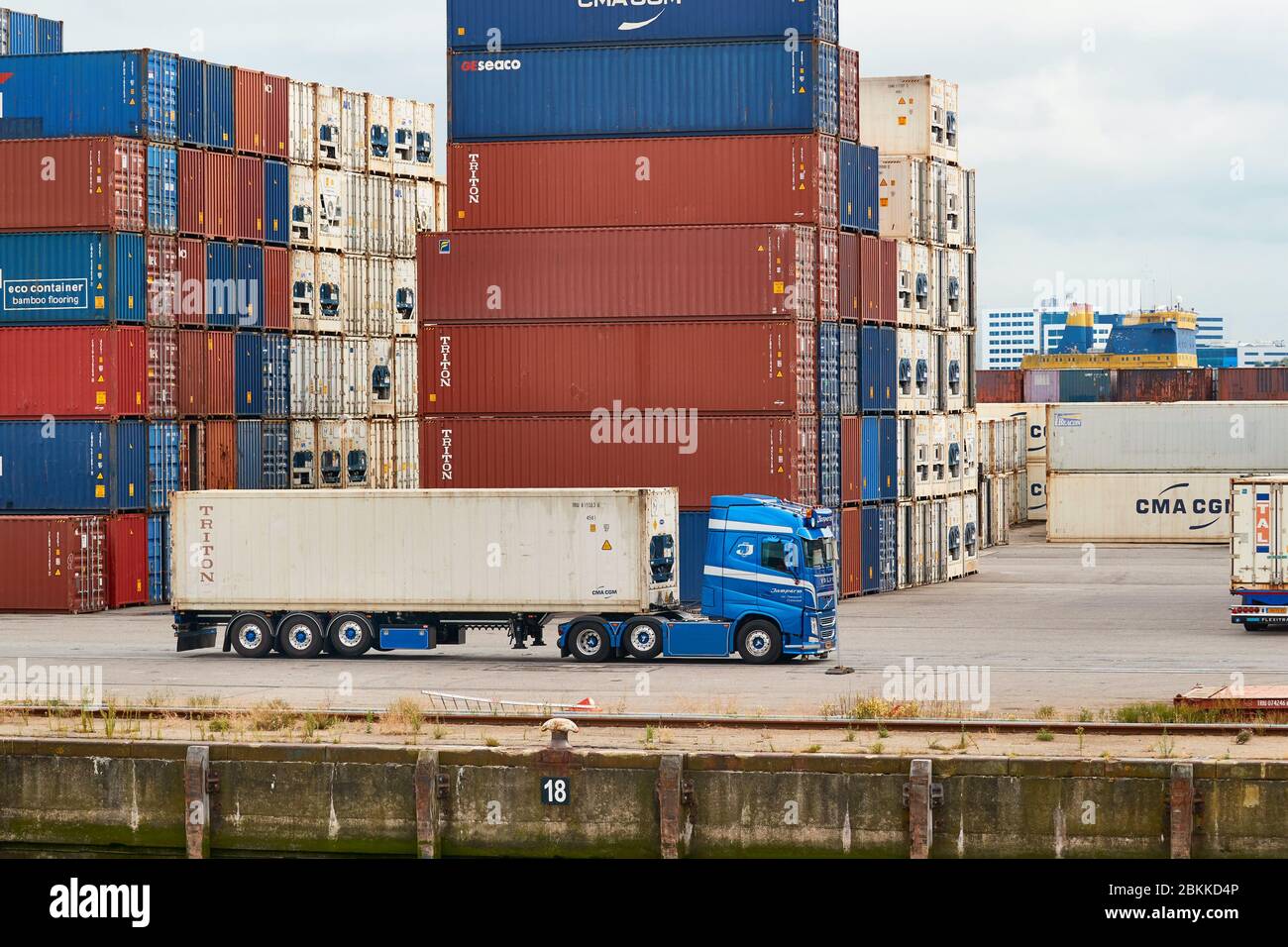 Container terminal in Rotterdam with truck in front of stack of ...
