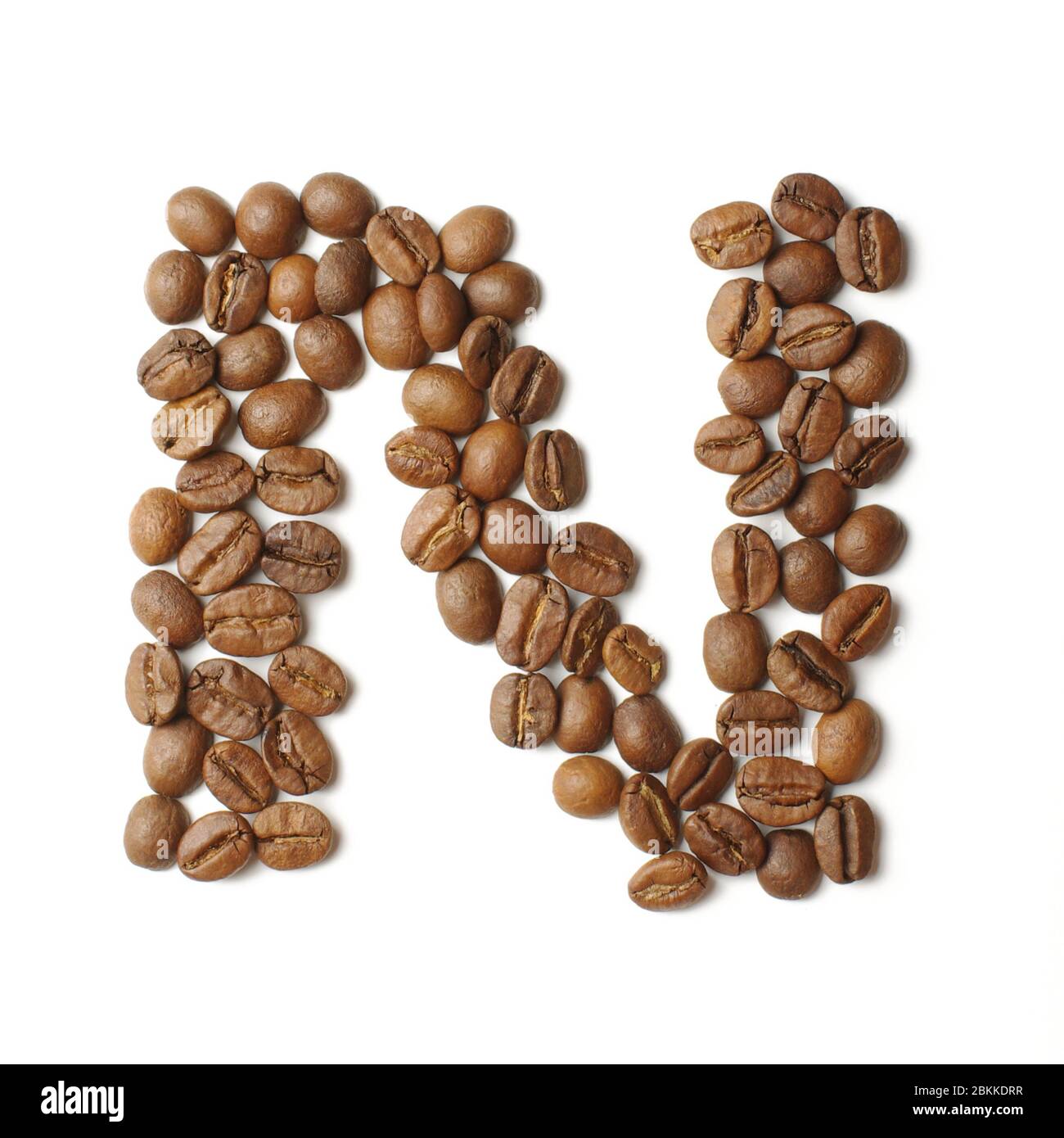 Letter N arranged from coffee beans isolated on the white background ...