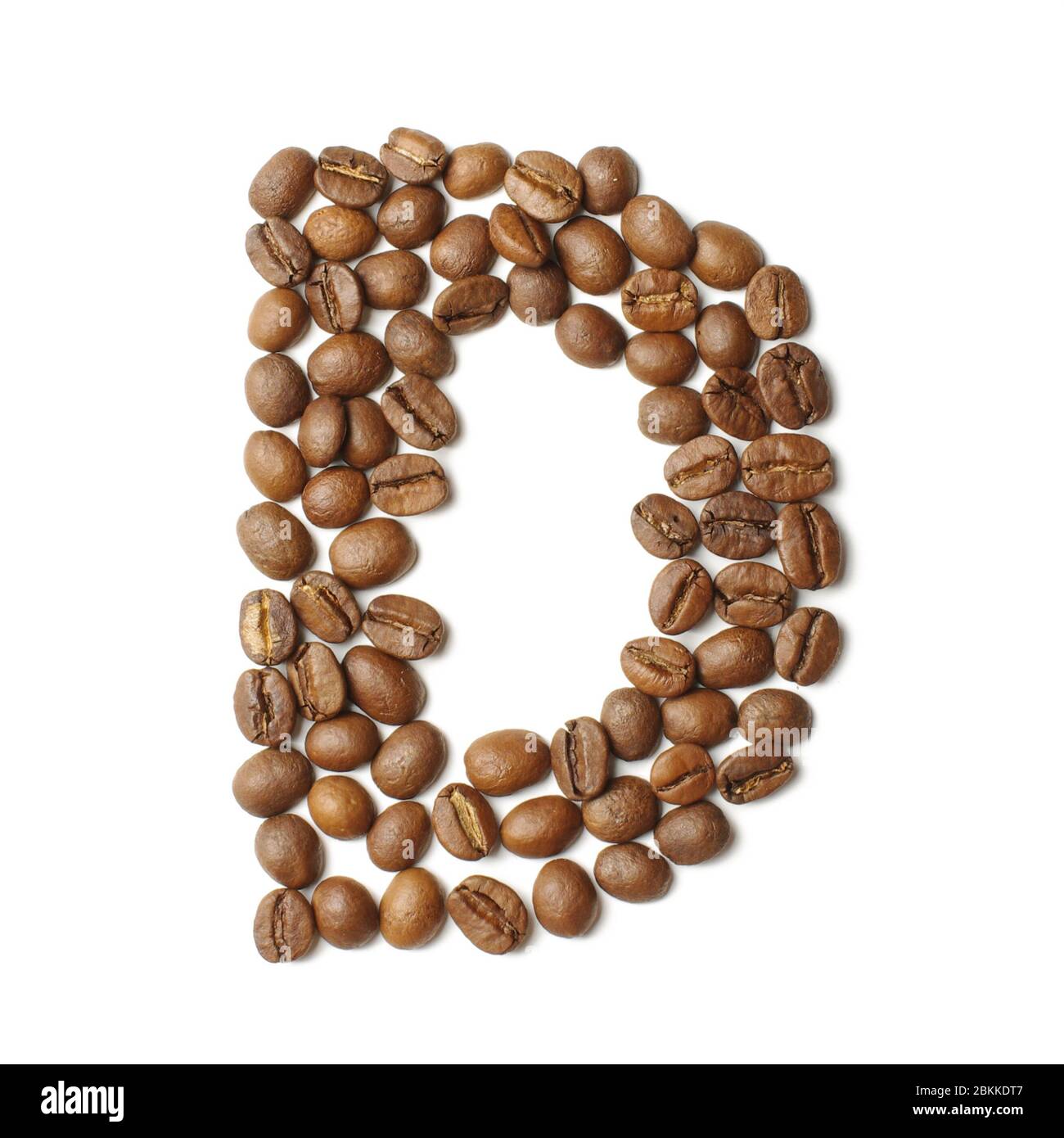 Letter D arranged from coffee beans isolated on the white background ...