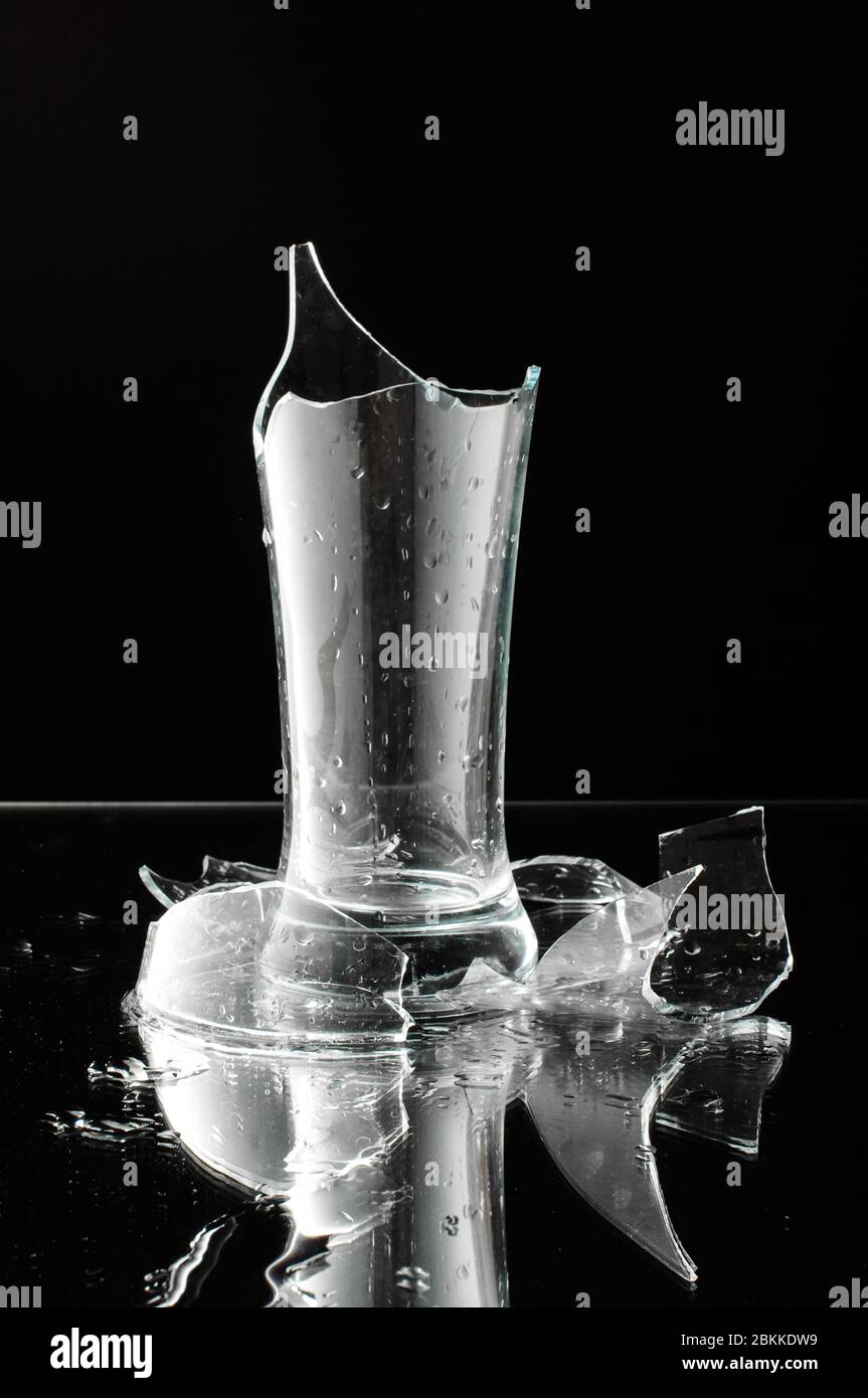 Cracked beer glass studio lit isolated on the black background Stock ...