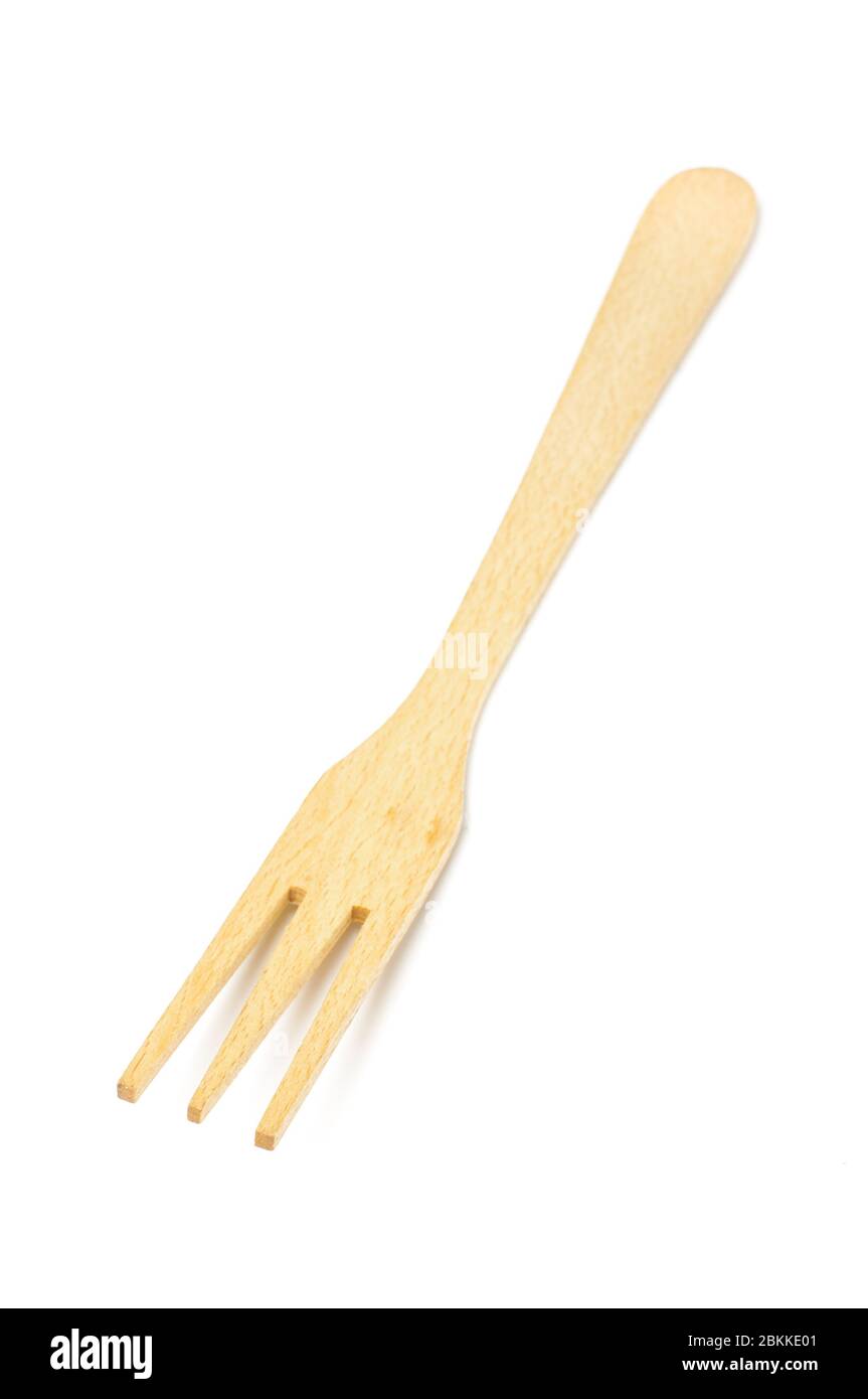 Decorative kitchen utensil fork made from wood isolated on the white ...