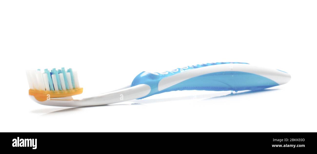 New toothbrush side view isolated on the white background Stock Photo ...