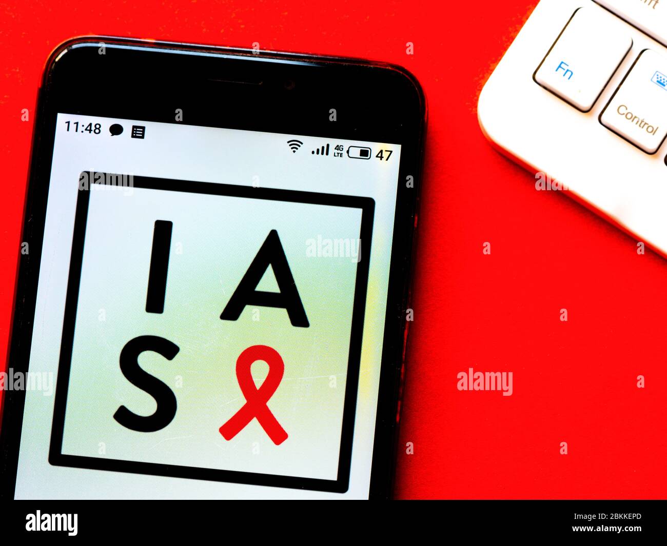In this photo illustration an International AIDS Society logo seen ...