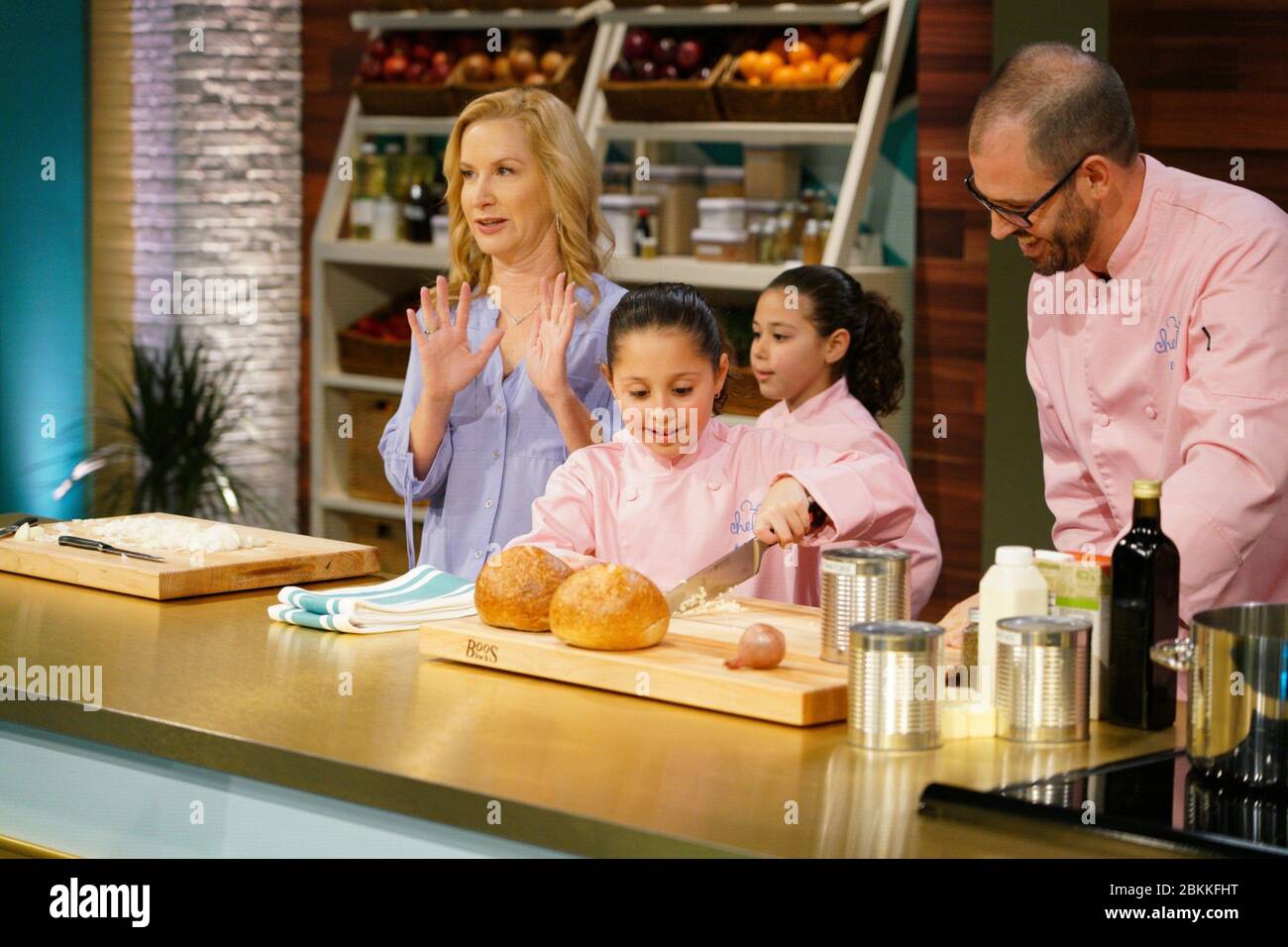 BE OUR CHEF, from left: host Angela Kinsey, contestants, Chef Eric ...