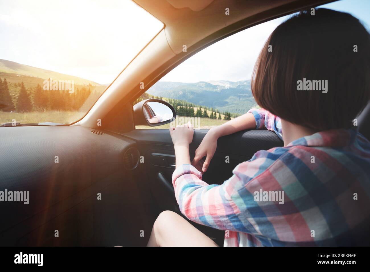 Summer Road Trip. Happy beautiful girl traveling in a car across at the ...