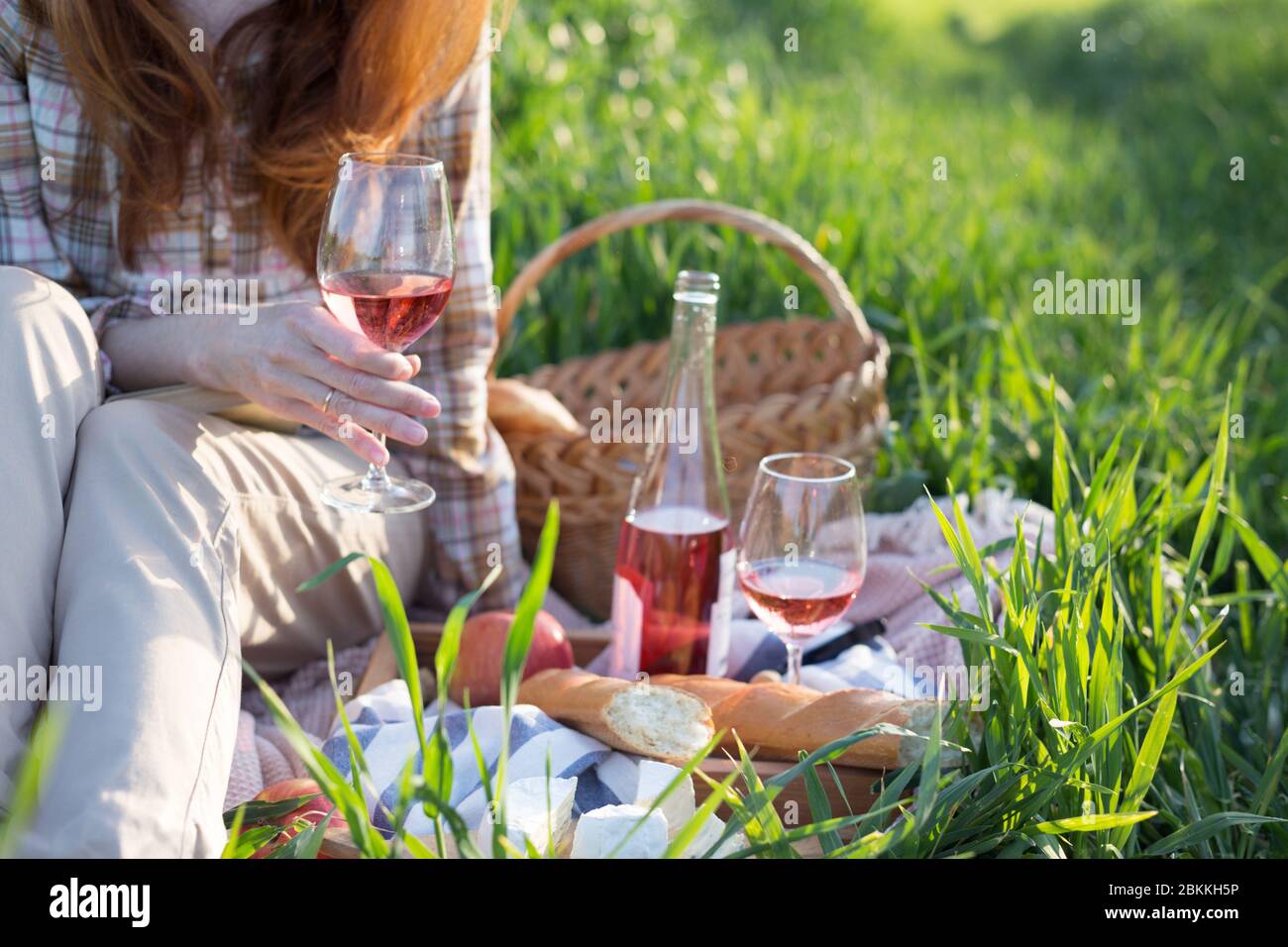 Summer - Provencal picnic in the meadow. girl with a glass of wine near ...