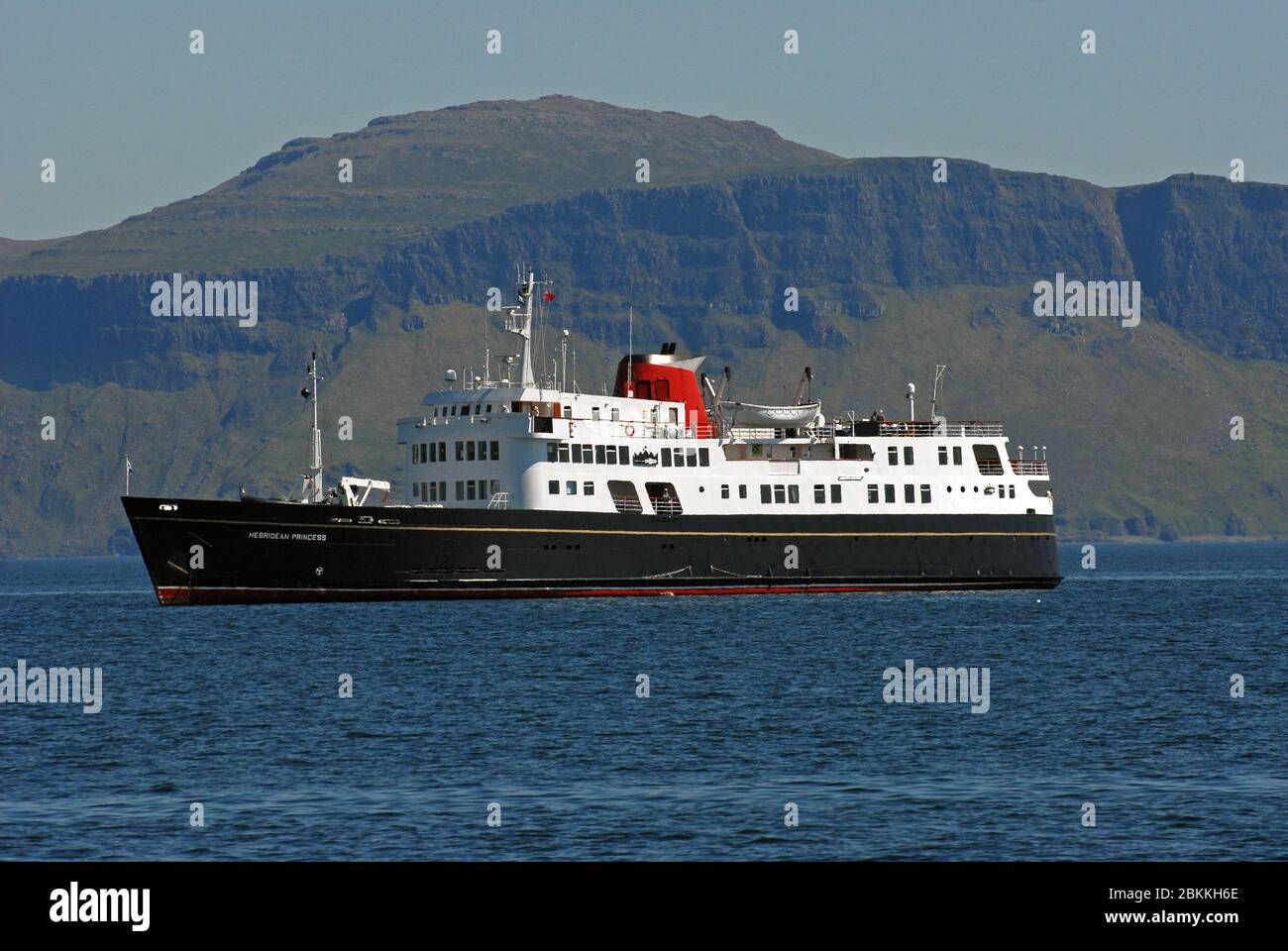 HEBRIDEAN PRINCESS at anchor off STAFFA, with the island of MULL beyond ...