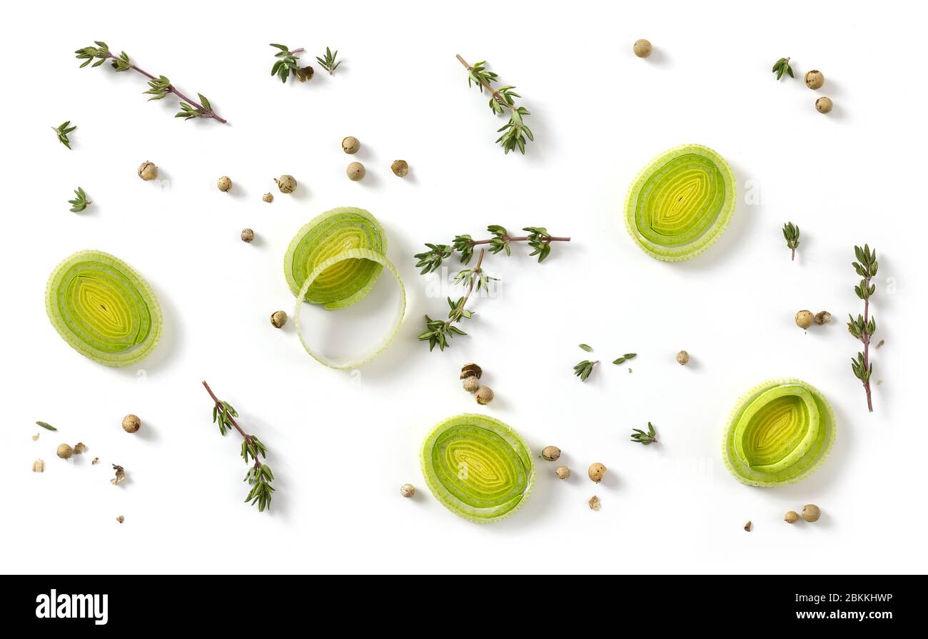 composition of leek slices and spices isolated on white background, top ...