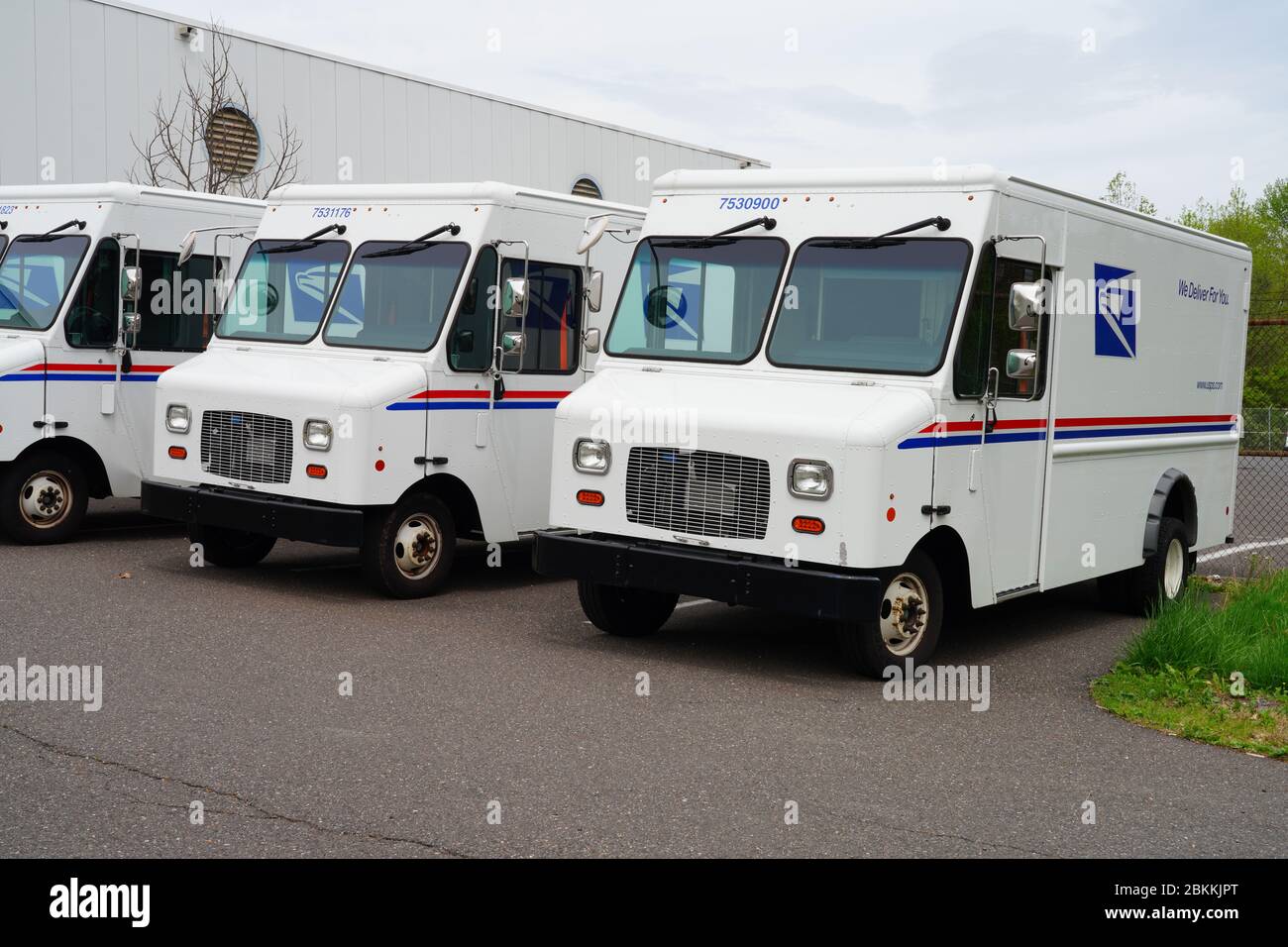 WEST WINDSOR, NJ -3 MAY 2020- View of mail delivery trucks from the ...