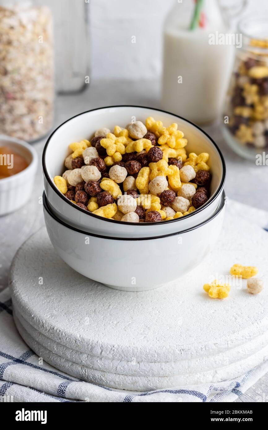 Assorted breakfast cereals: chocolate balls and honey stars Stock Photo ...