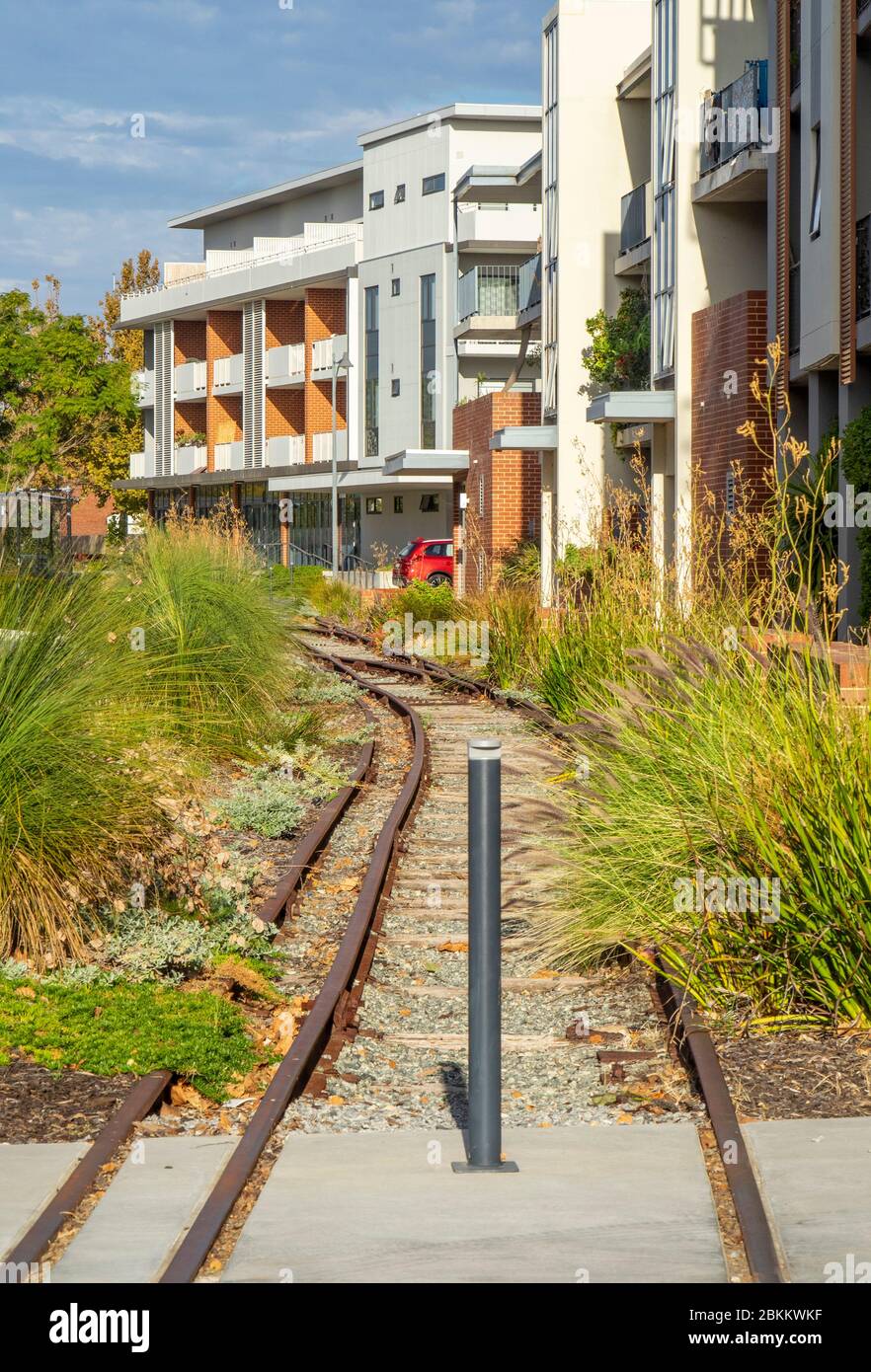 Old railway tracks passing a new medium density residential development ...