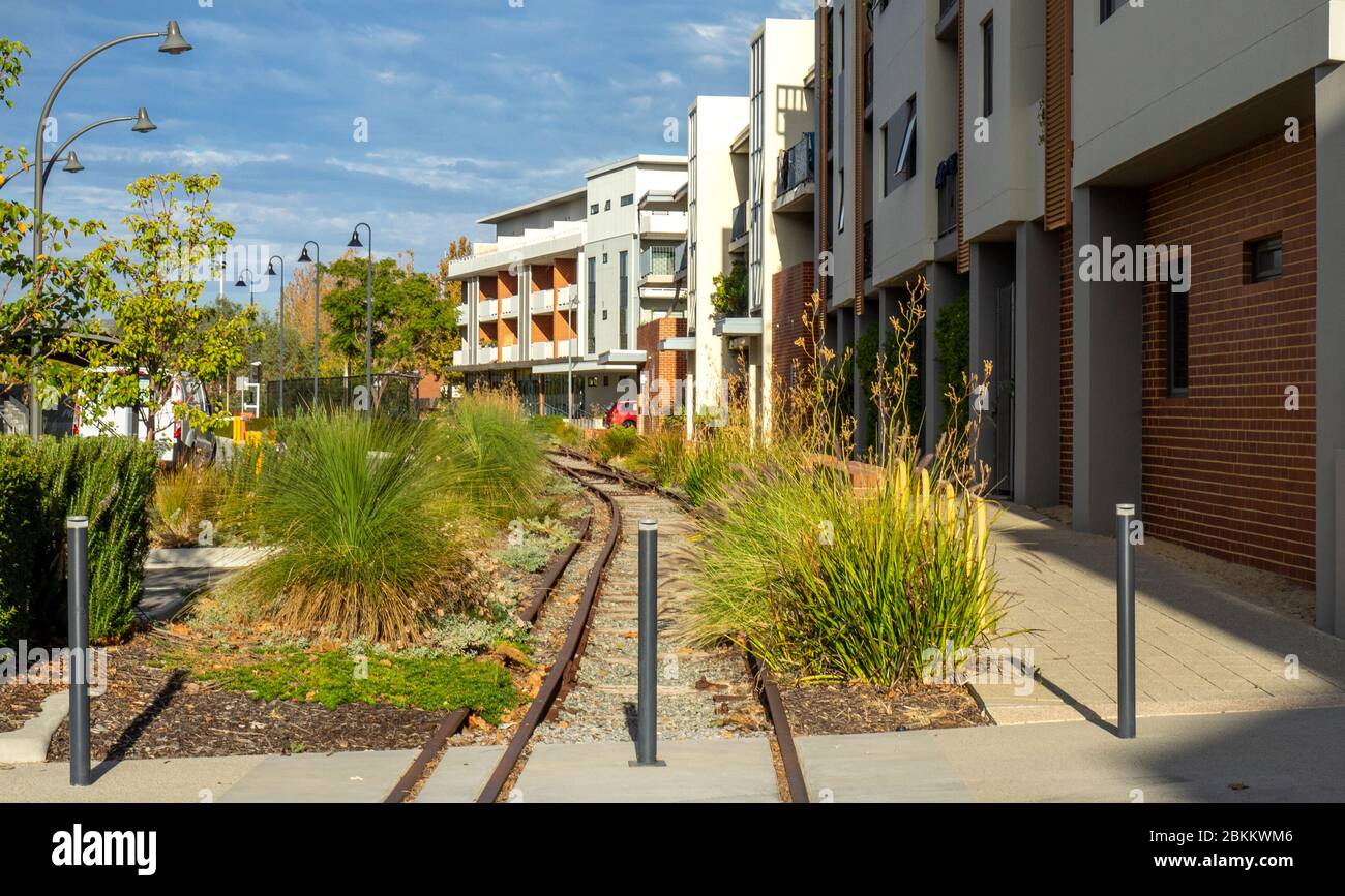 Old railway tracks passing a new medium density residential development ...