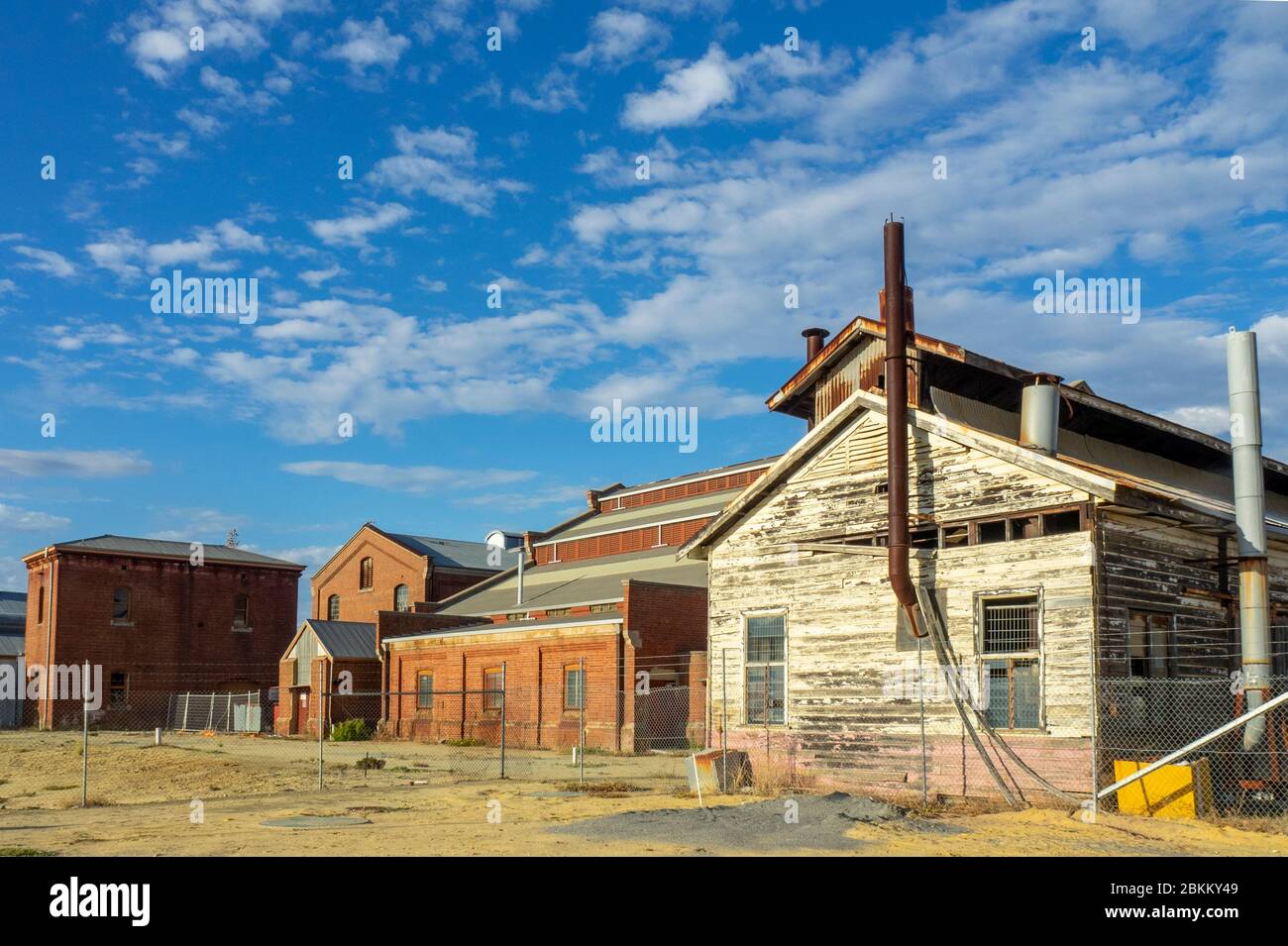 Wooden building and red brick building Power House at former Midland ...