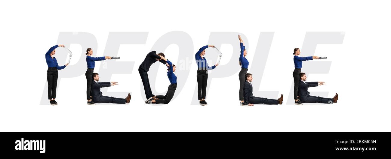 Group of workers forming people word at studio Stock Photo - Alamy