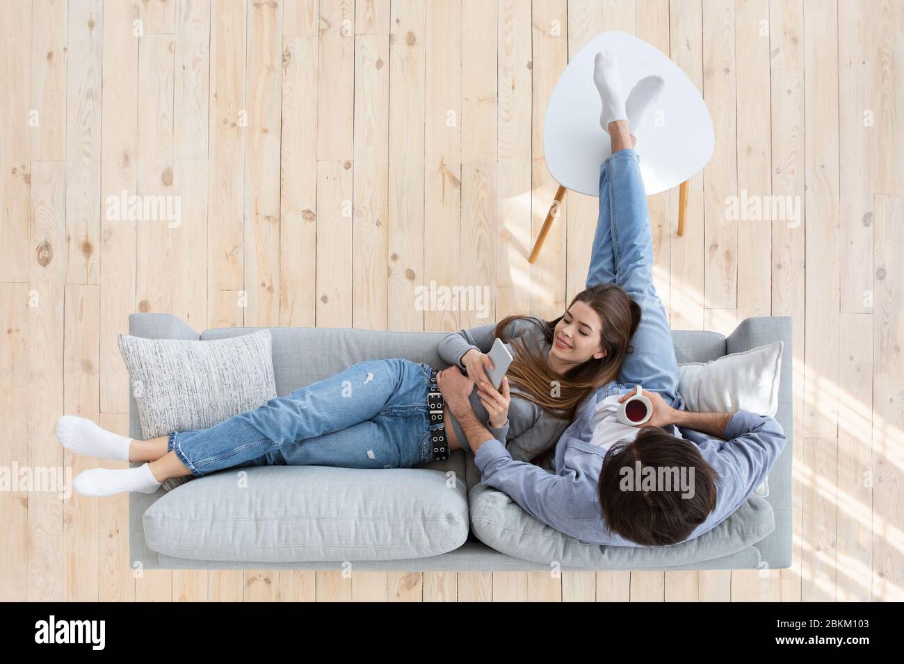 Family using electronic gadgets hi-res stock photography and images - Alamy