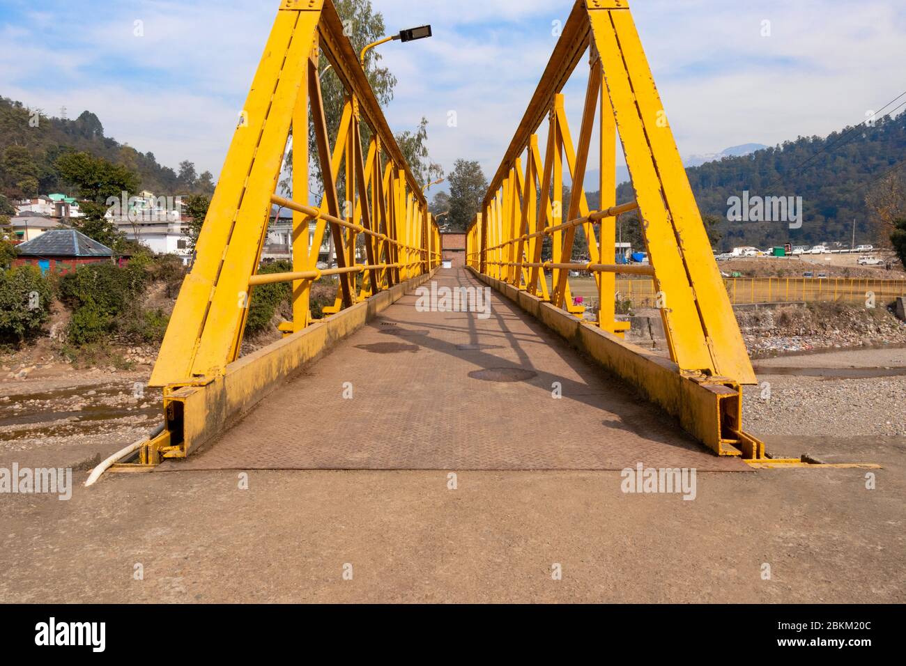 Yellow steel bridge over river in himachal pradesh in Kangra village ...