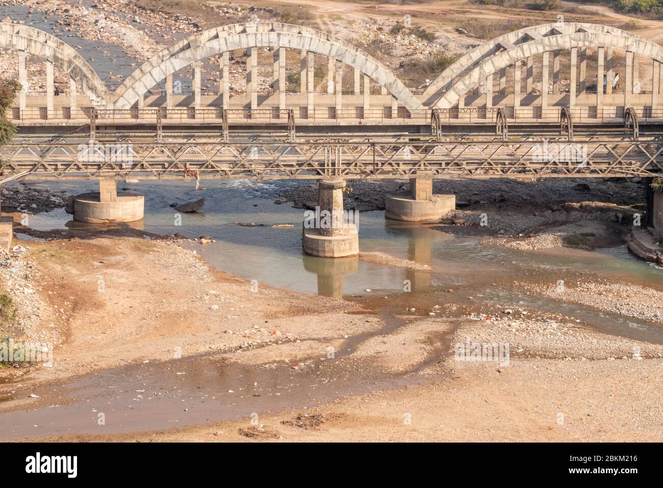 Concrete bridge with concrete pillars over the river Stock Photo - Alamy
