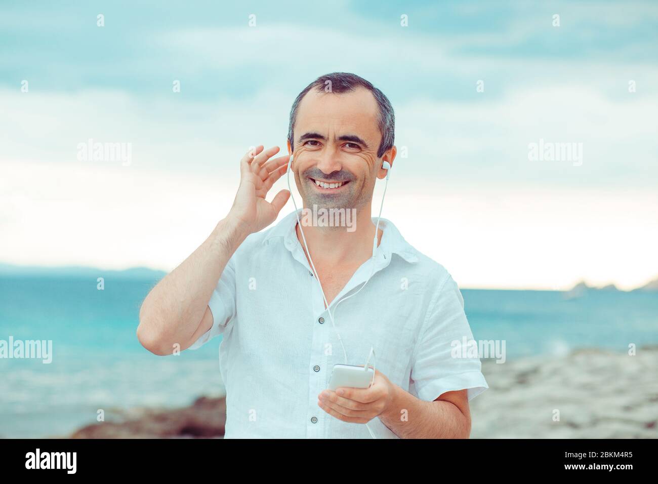 Man listening to music. Close up portrait smiling man guy listening to ...