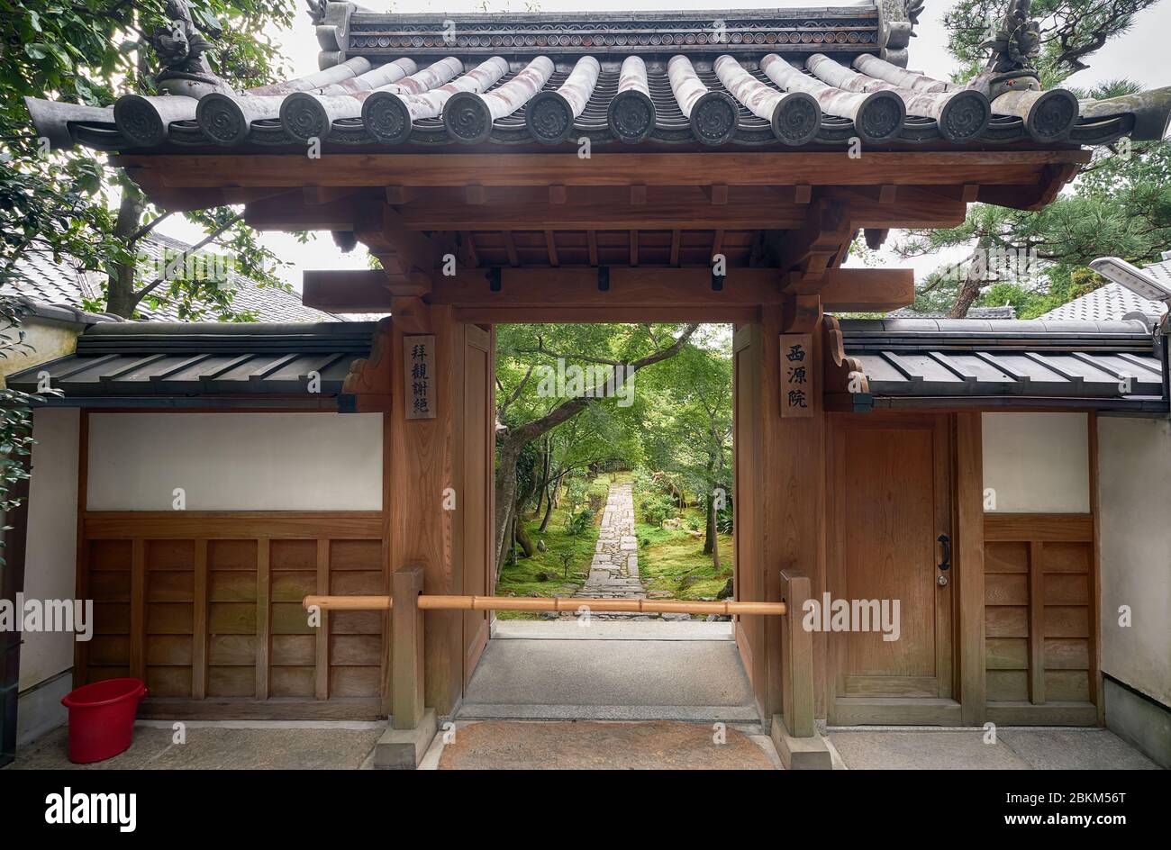Traditional Japanese wooden gate to the garden of Ryoan-ji temple ...