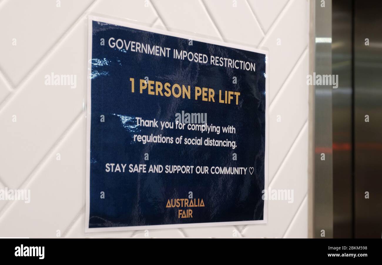Sign next to a shopping centre lift says only 1 person permitted at a ...