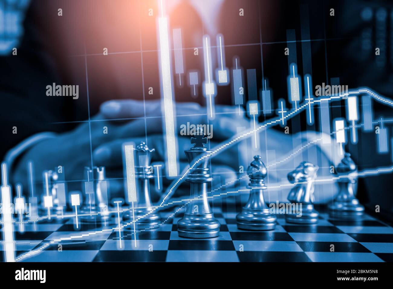Chess game on chess board on stock market or forex trading graph chart ...