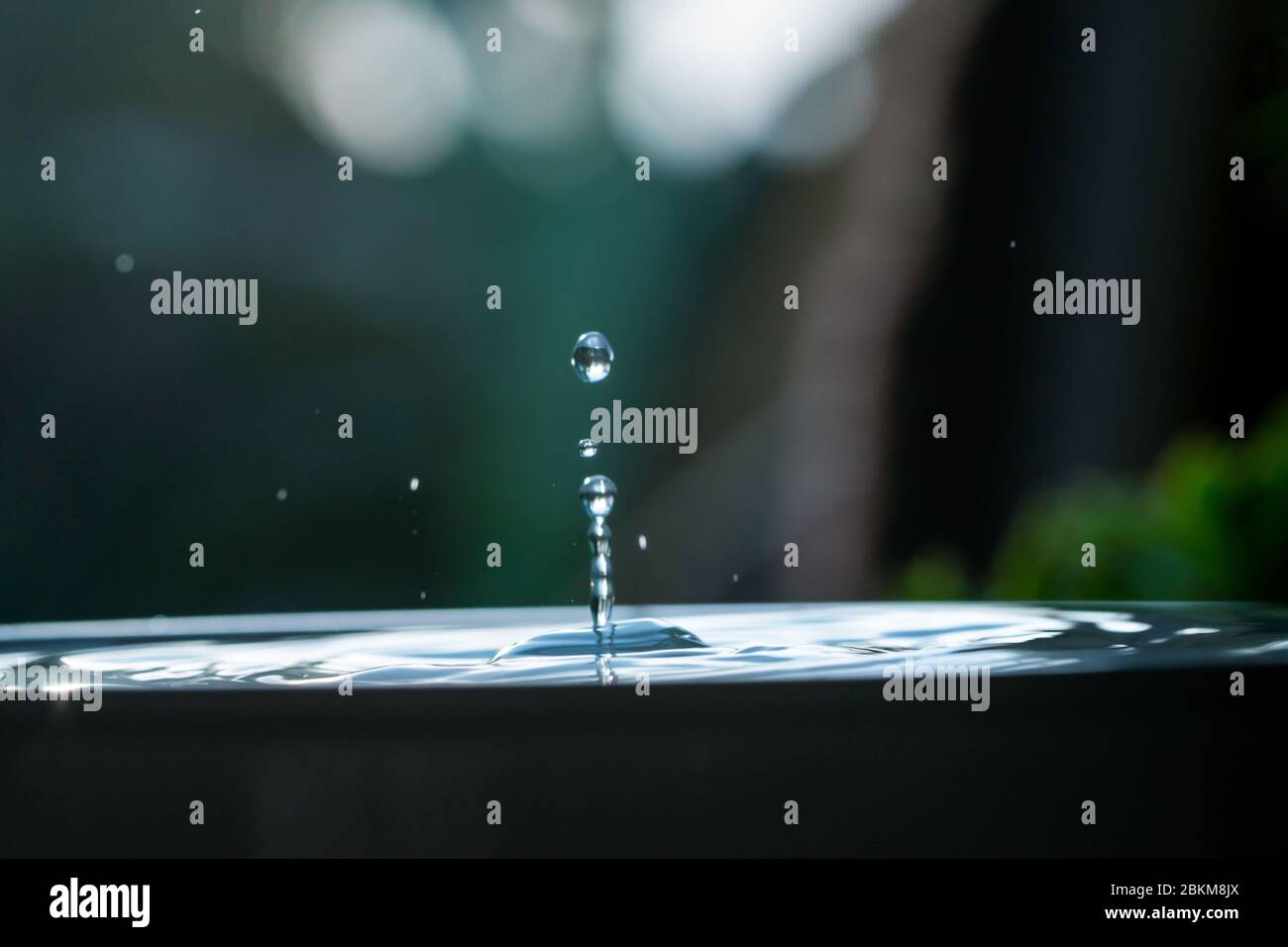 Water Drop splash with sun Stock Photo - Alamy