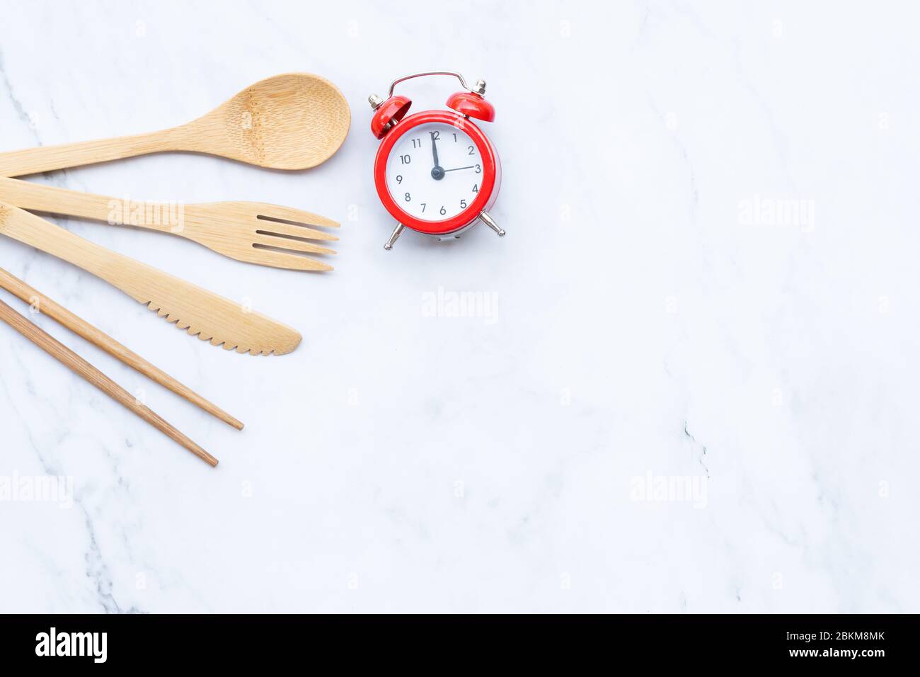 50s vintage red clock on luxury marble textured background office table ...