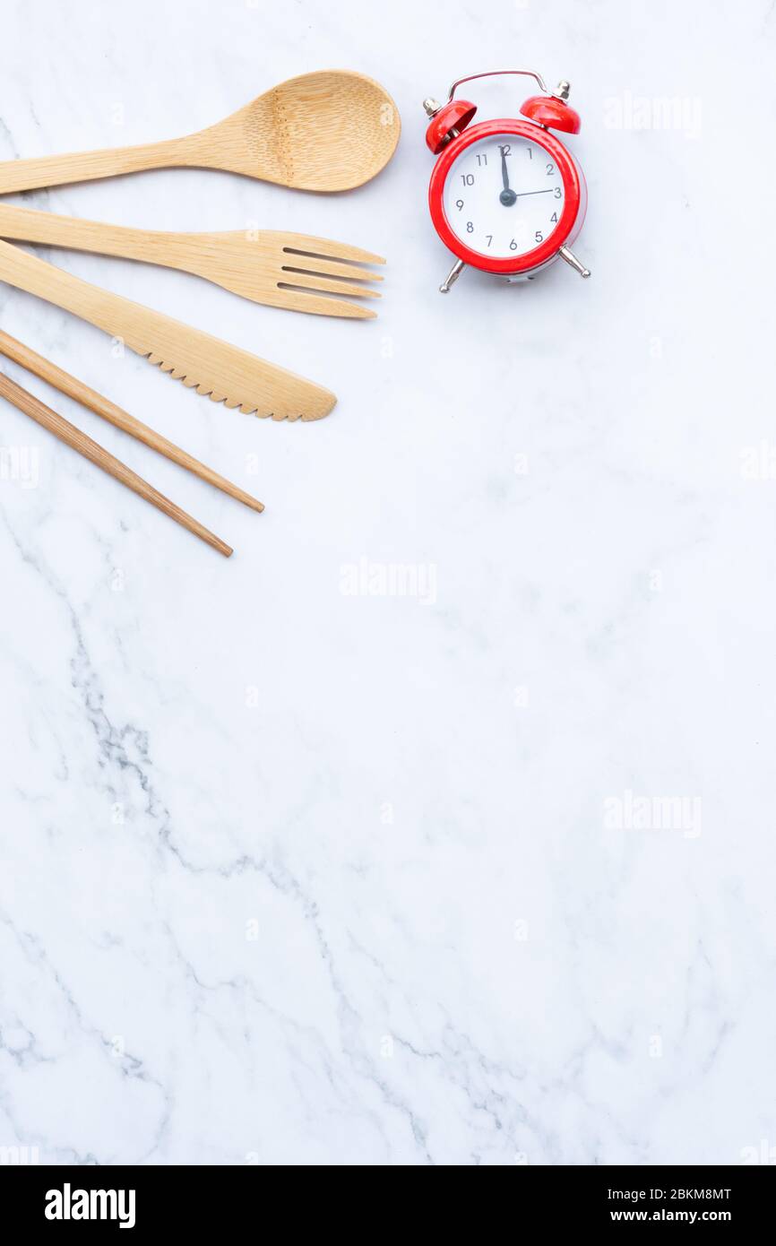 50s vintage red clock on luxury marble textured background office table ...