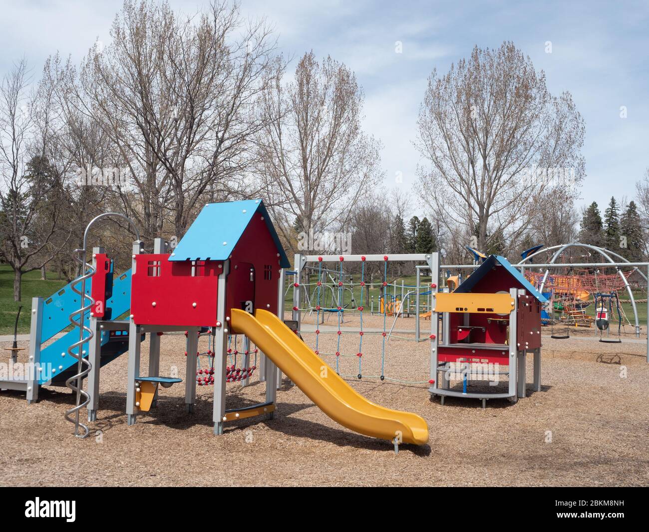 Empty city park playground with slide and playhouse for young children ...