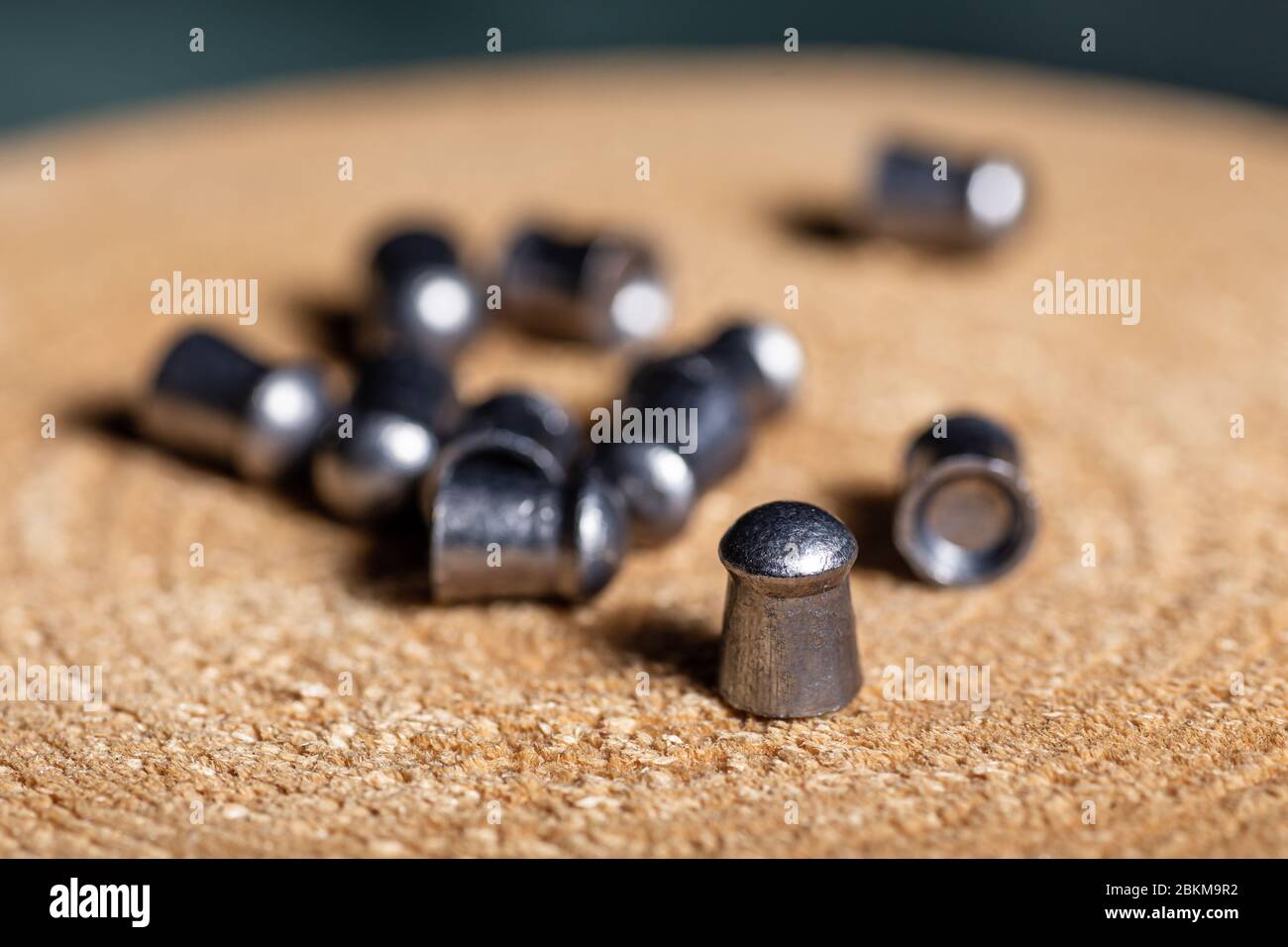 Lead bullets for an air rifle on a tree cut Stock Photo - Alamy