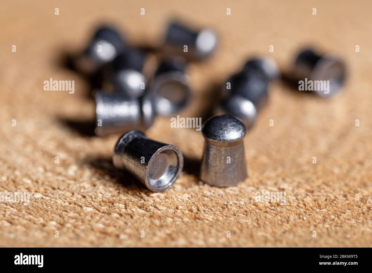 Lead bullets for an air rifle on a tree cut Stock Photo - Alamy
