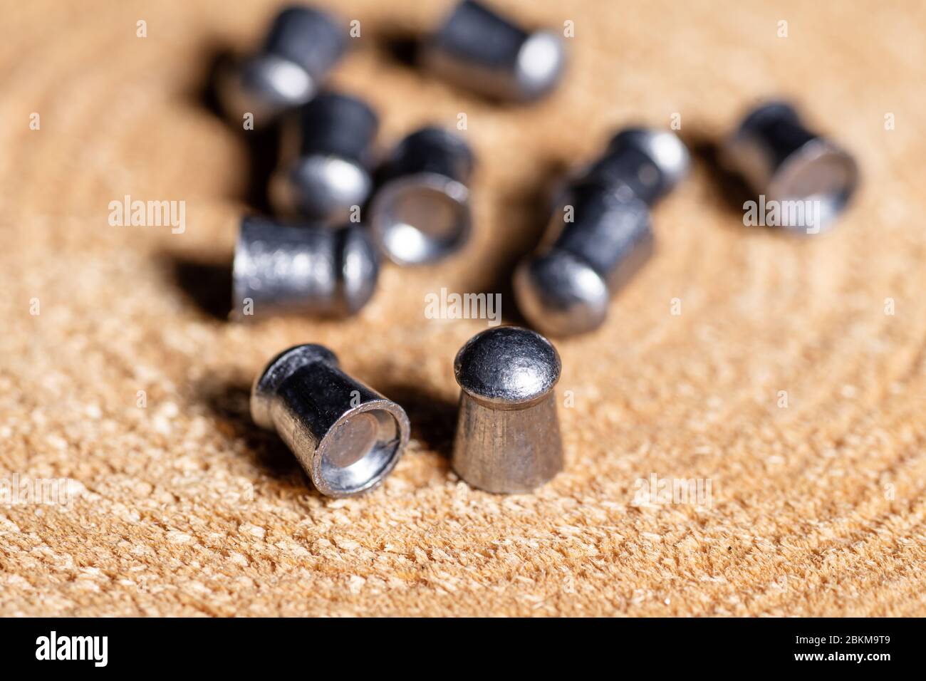 Lead bullets for an air rifle on a tree cut Stock Photo - Alamy