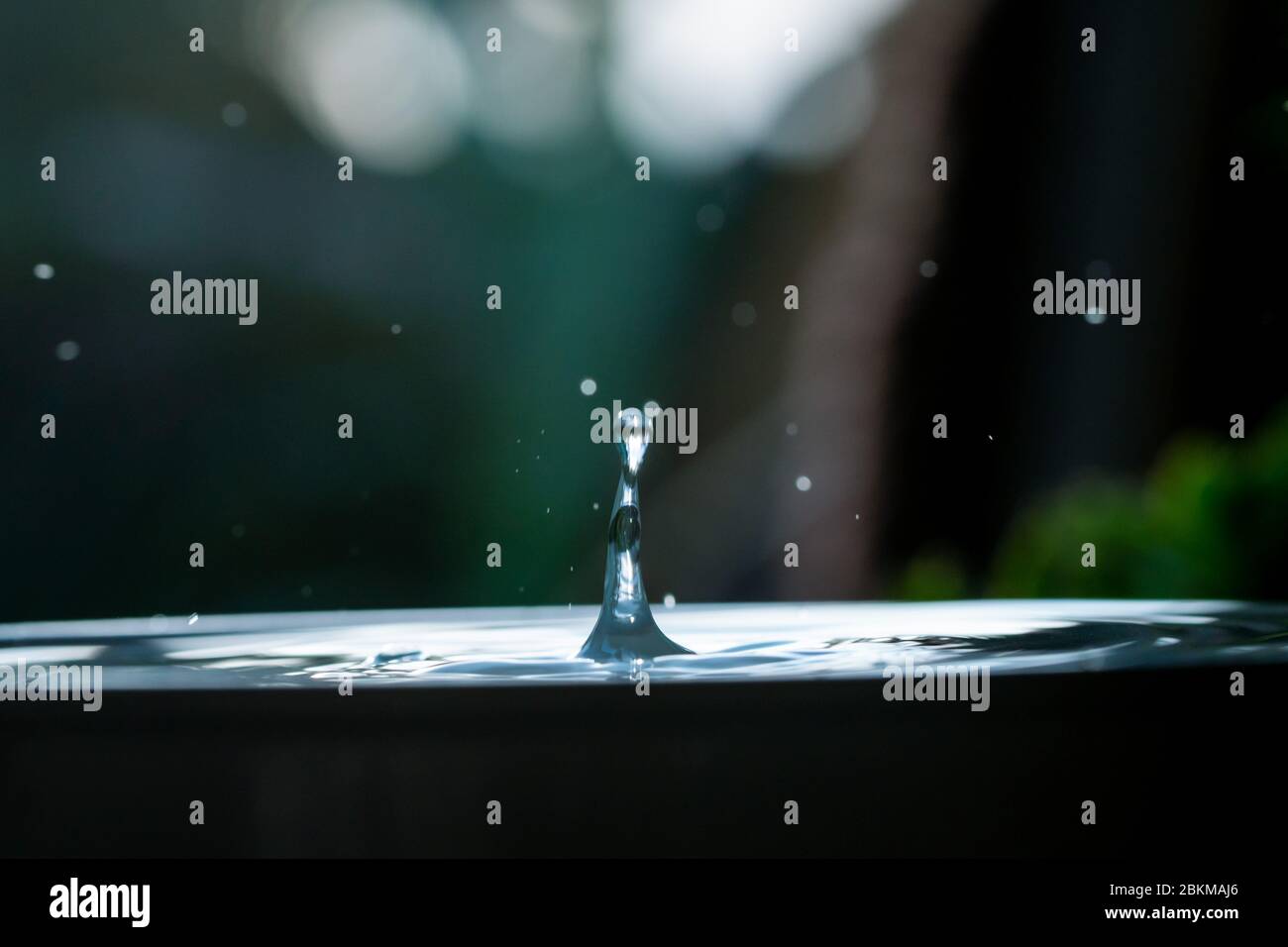 Water Drop splash with sun Stock Photo - Alamy