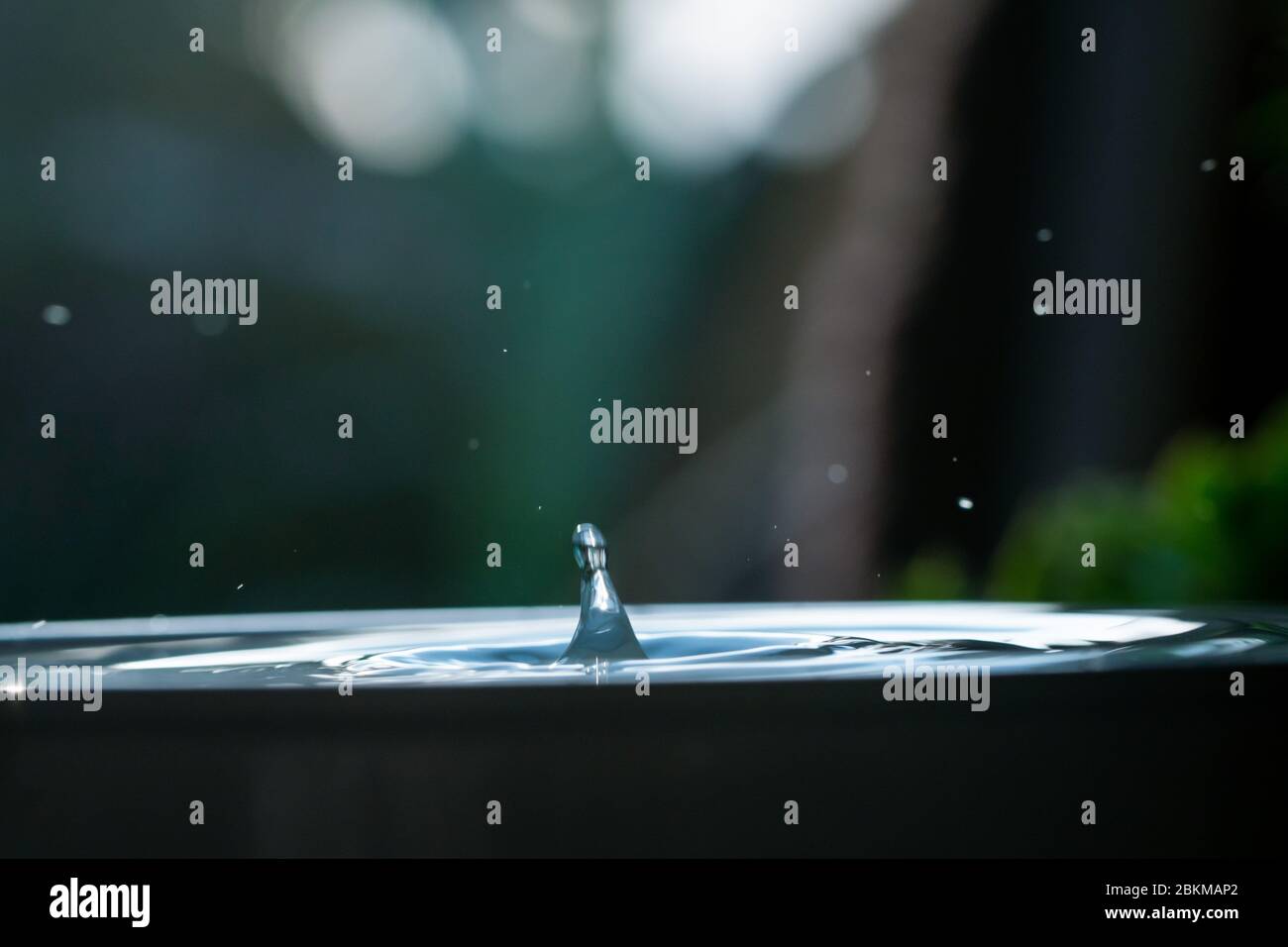 Water Drop splash with sun Stock Photo - Alamy